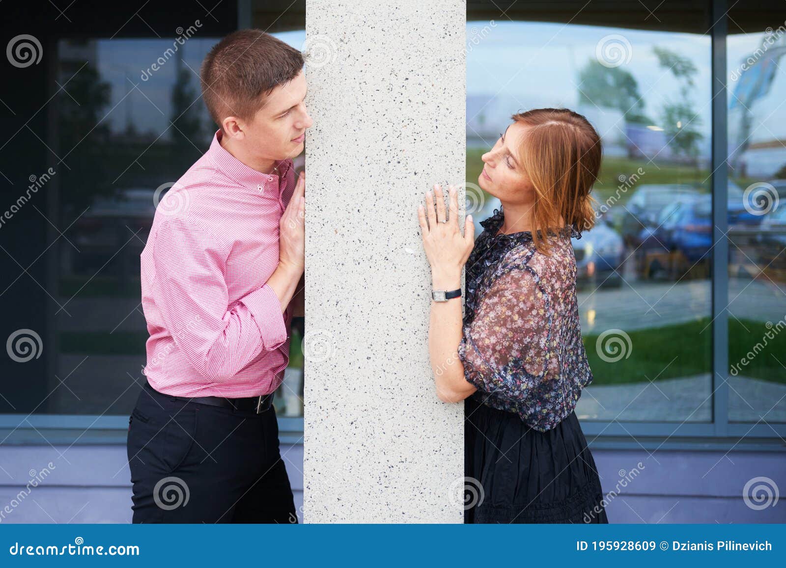 Image of a Young Couple Hugging a Concrete Pole Stock Image - Image of ...