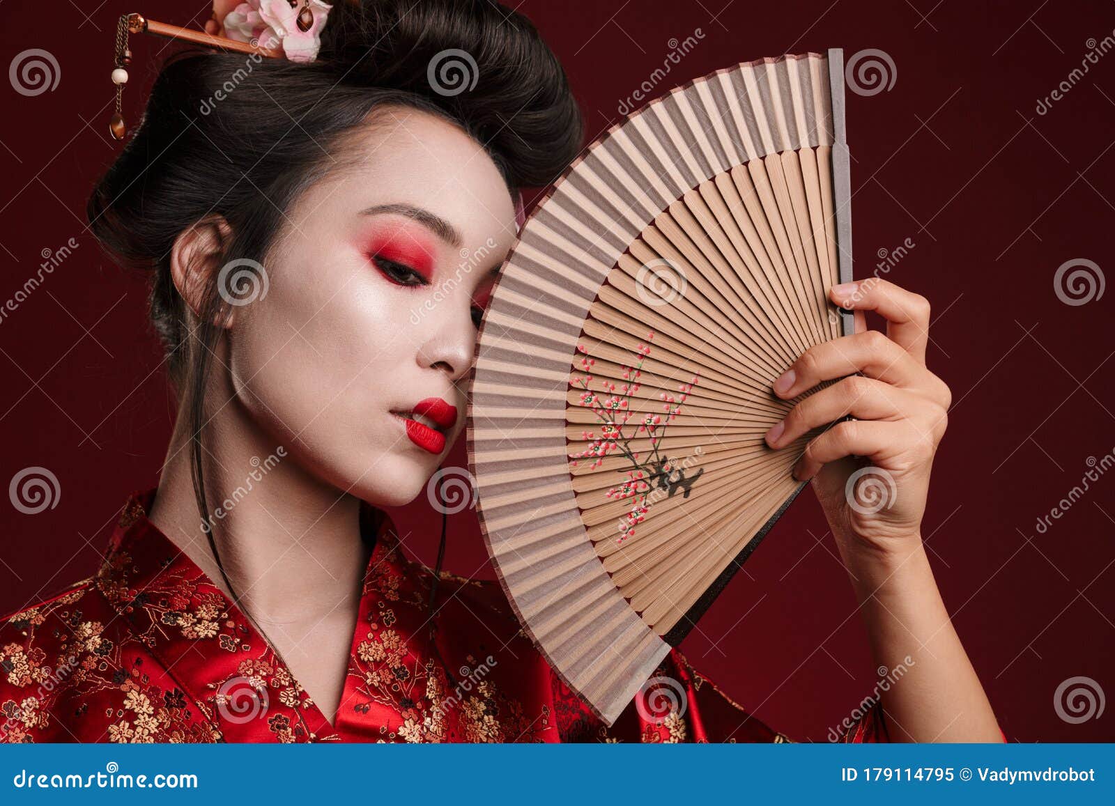 Image Of Young Geisha Woman In Japanese Kimono Holding Wooden Hand Fan
