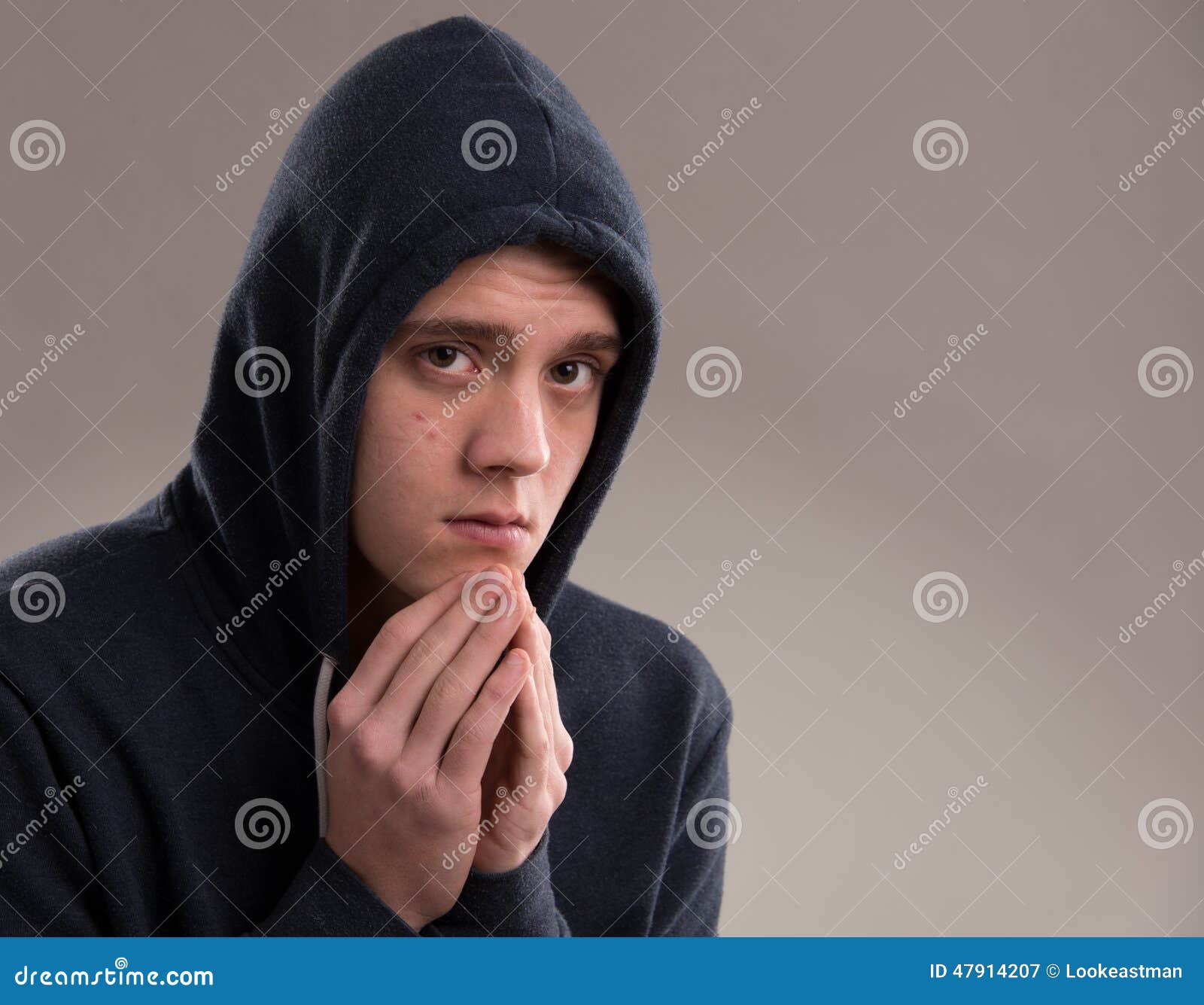 Image of Young Man in Hooded Sweater Stock Image - Image of looking ...