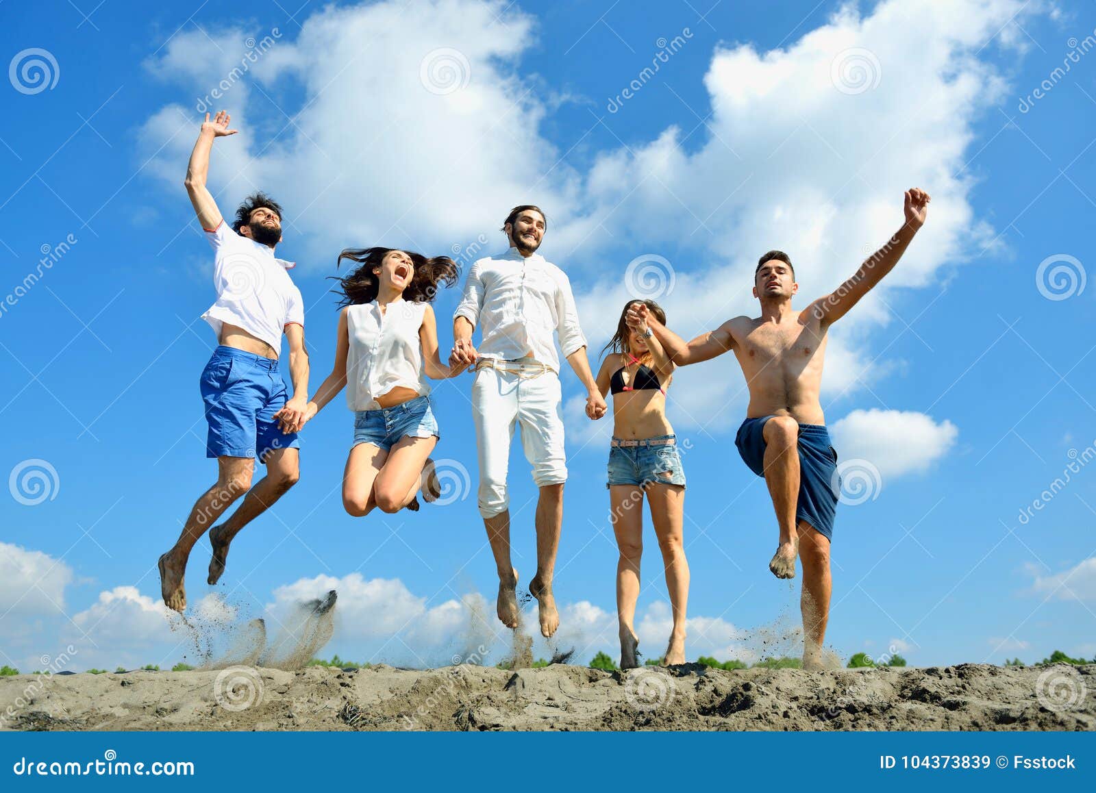 Image of Young People Jumping Together Outdoor. Stock Image - Image of ...