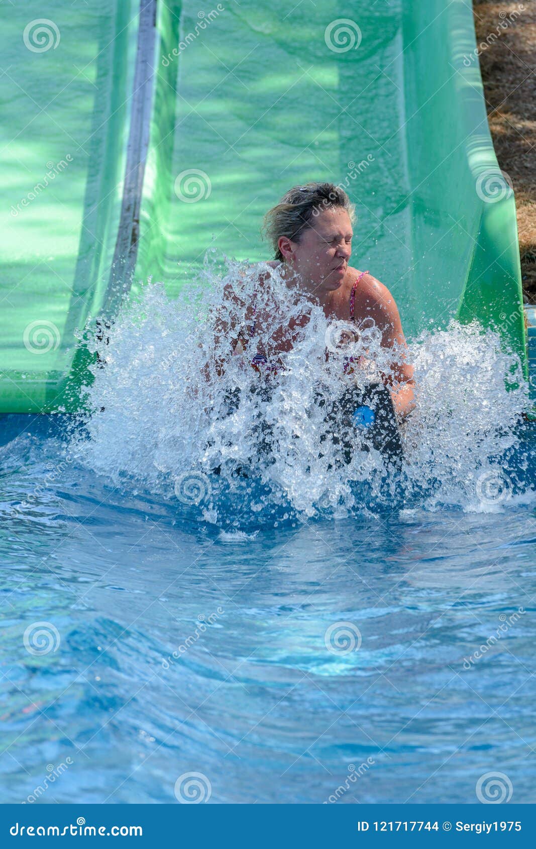 Young Woman Ride On A Slide In A Water Park Stock Photo - Image of ...