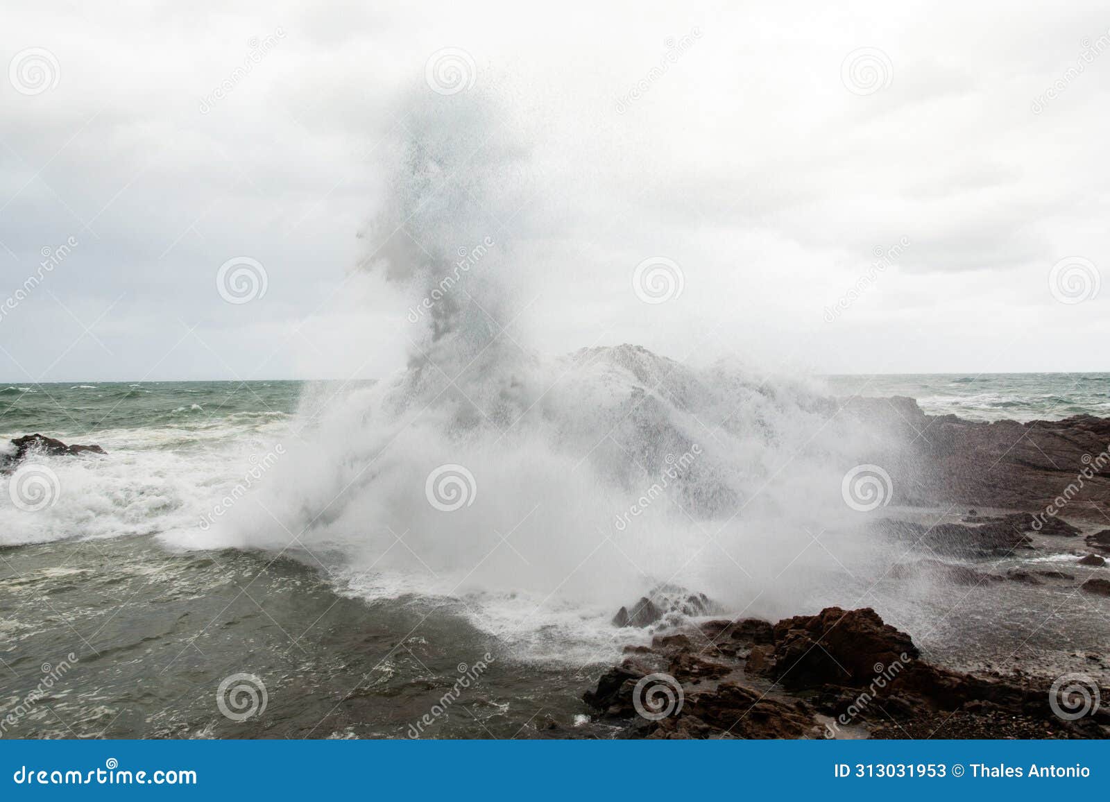 Immense Waves Hitting a Large Rock at the Edge of the Beach. Force of ...