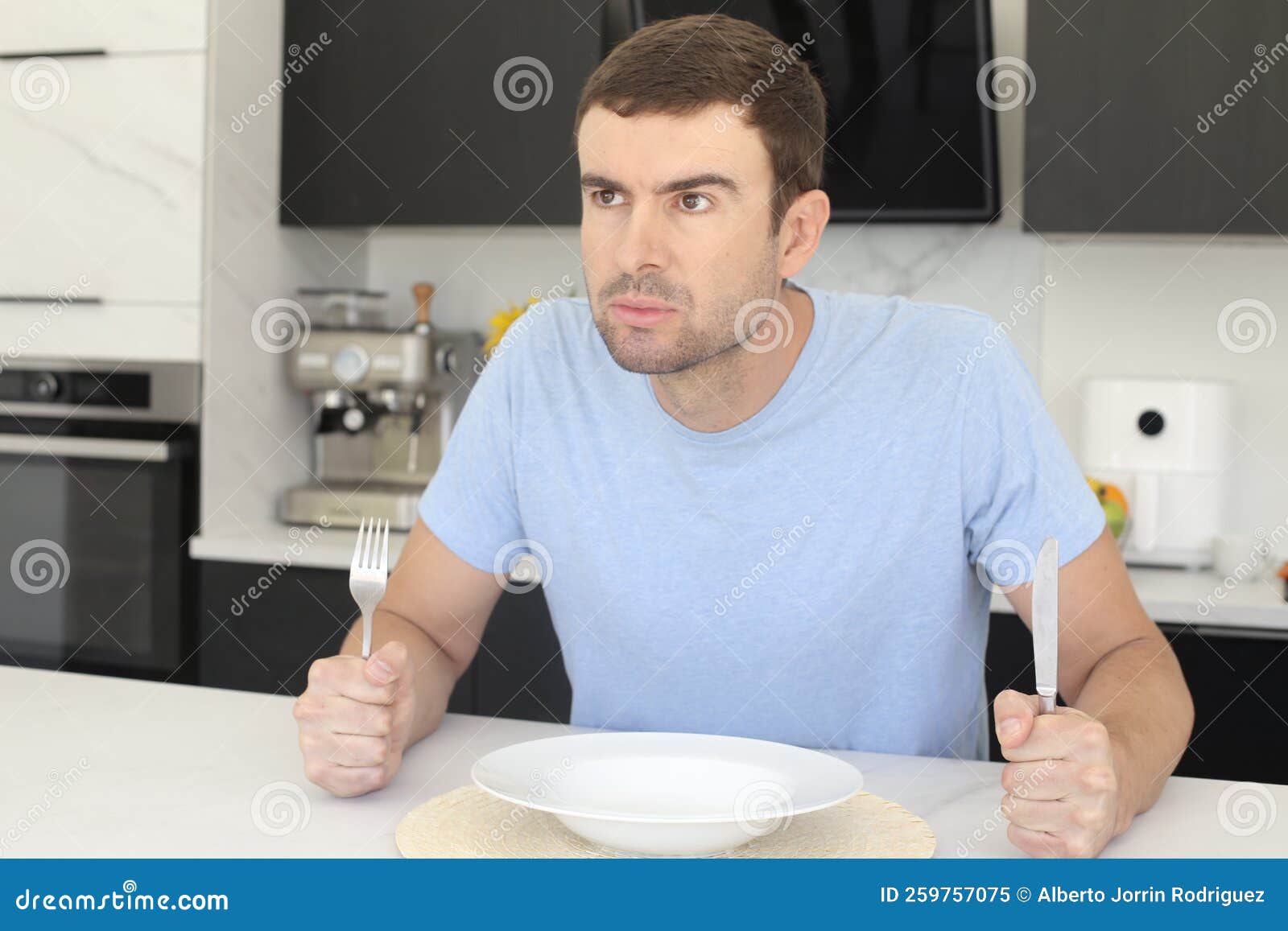 Impatient Looking Man Waiting for Dinner To Be Served Stock Image ...