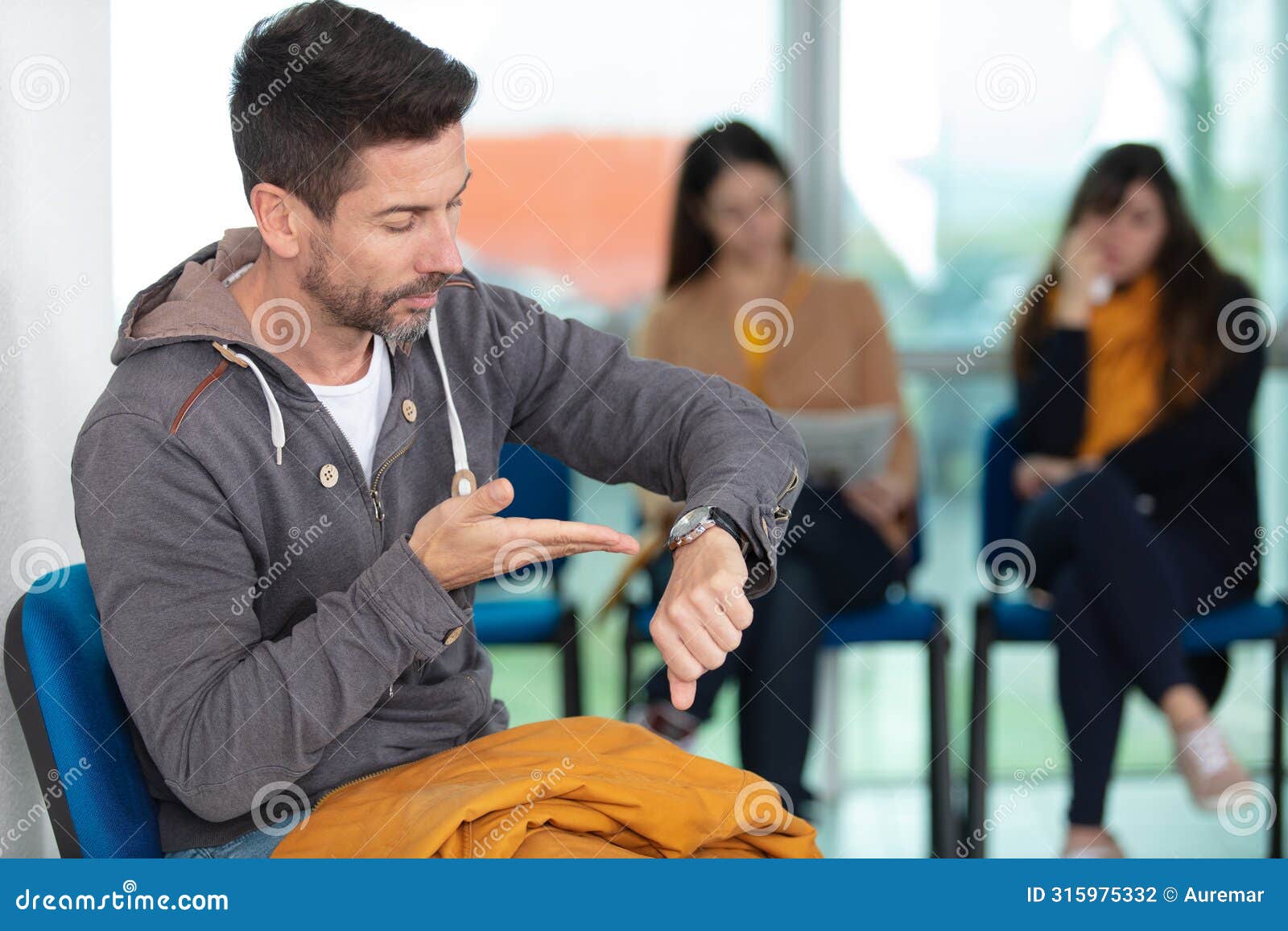 Impatient Man in Waiting Room Checking Watch Stock Photo - Image of ...