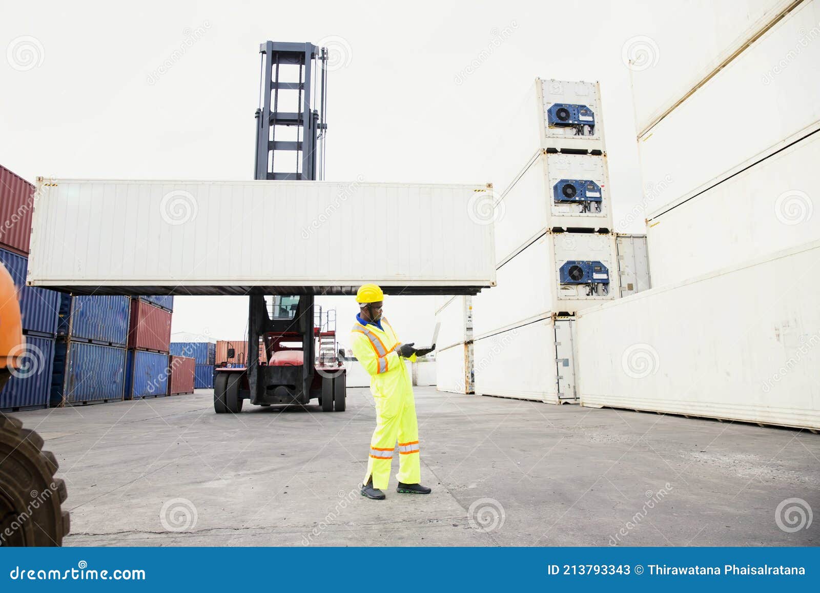 Import and Export Concept. Foreman Using Laptop Computer in the Port of ...