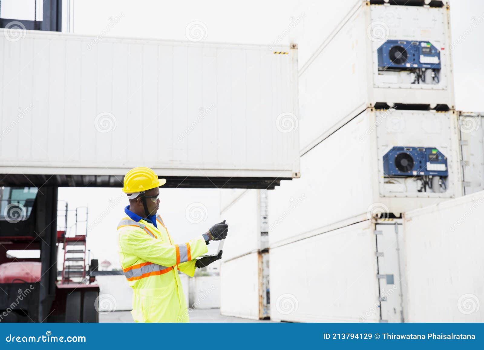 Import and Export Concept. Foreman Using Laptop Computer in the Port of ...