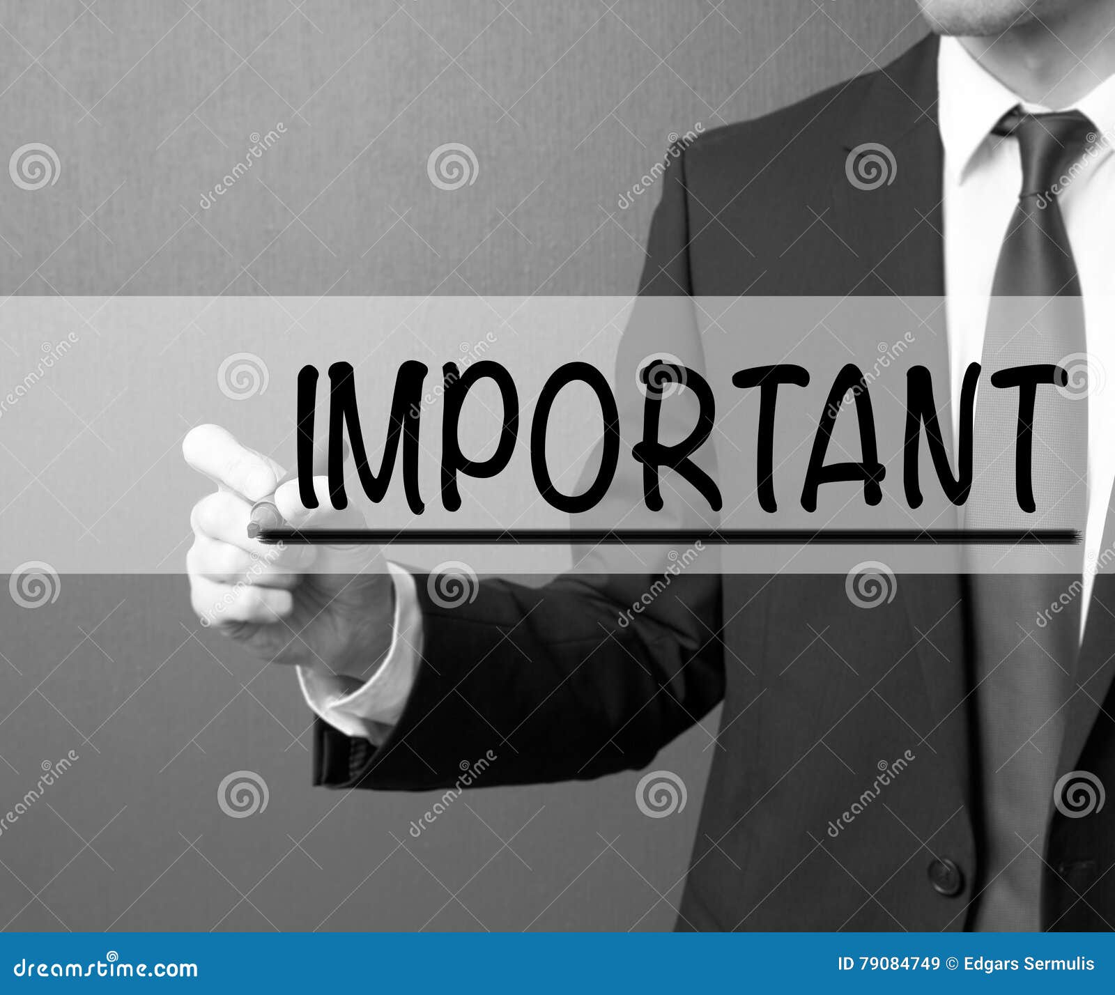 Important. Businessman in a Suit with a Marker Writing on Visual Stock ...