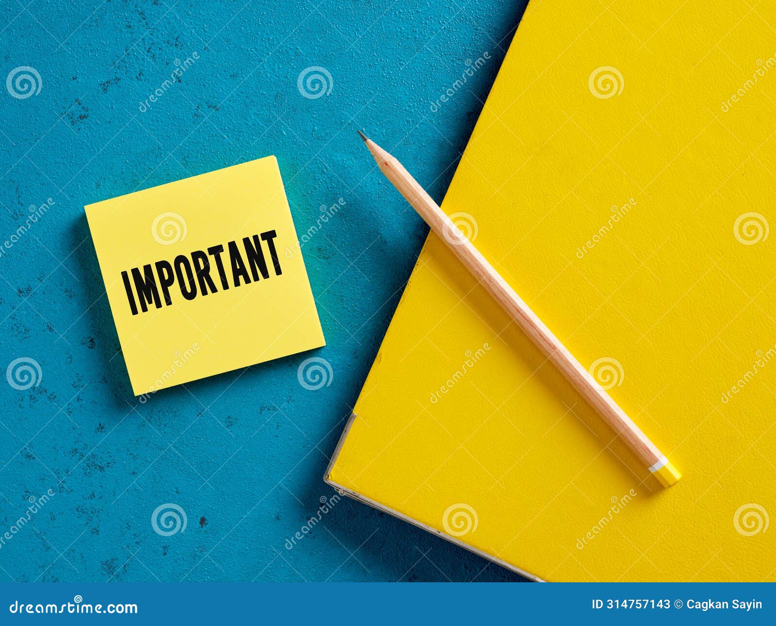 Important Message on Yellow Sticky Note Paper with a Pencil and Binder ...