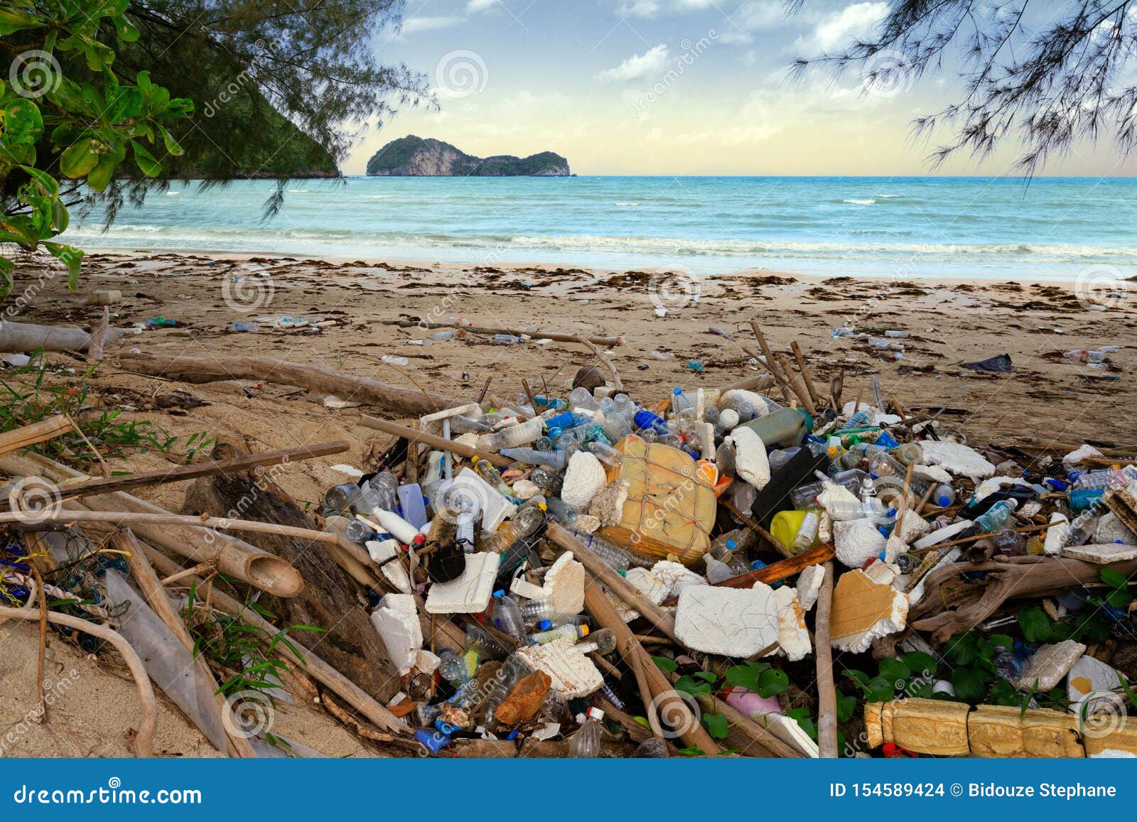 Beach plastic pollution stock photo. Image of messy - 154589424