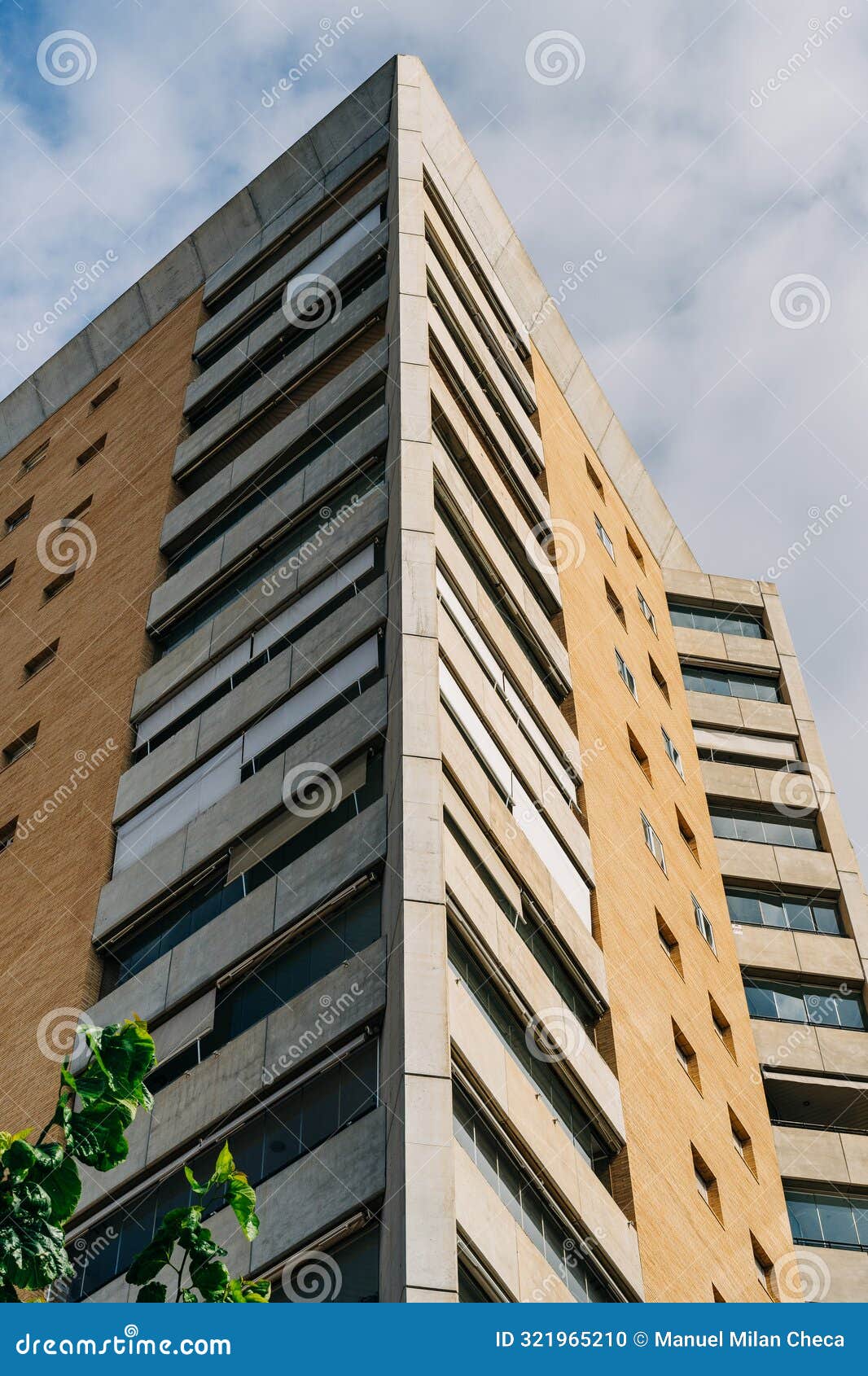 Imposing Building Rising Towards a Blue Sky with Clouds. Architecture ...
