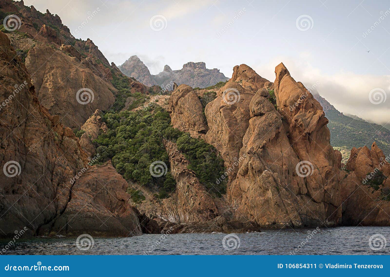 Imposing Rock Formations Covered with Green Shrubs and Sunlit by the ...