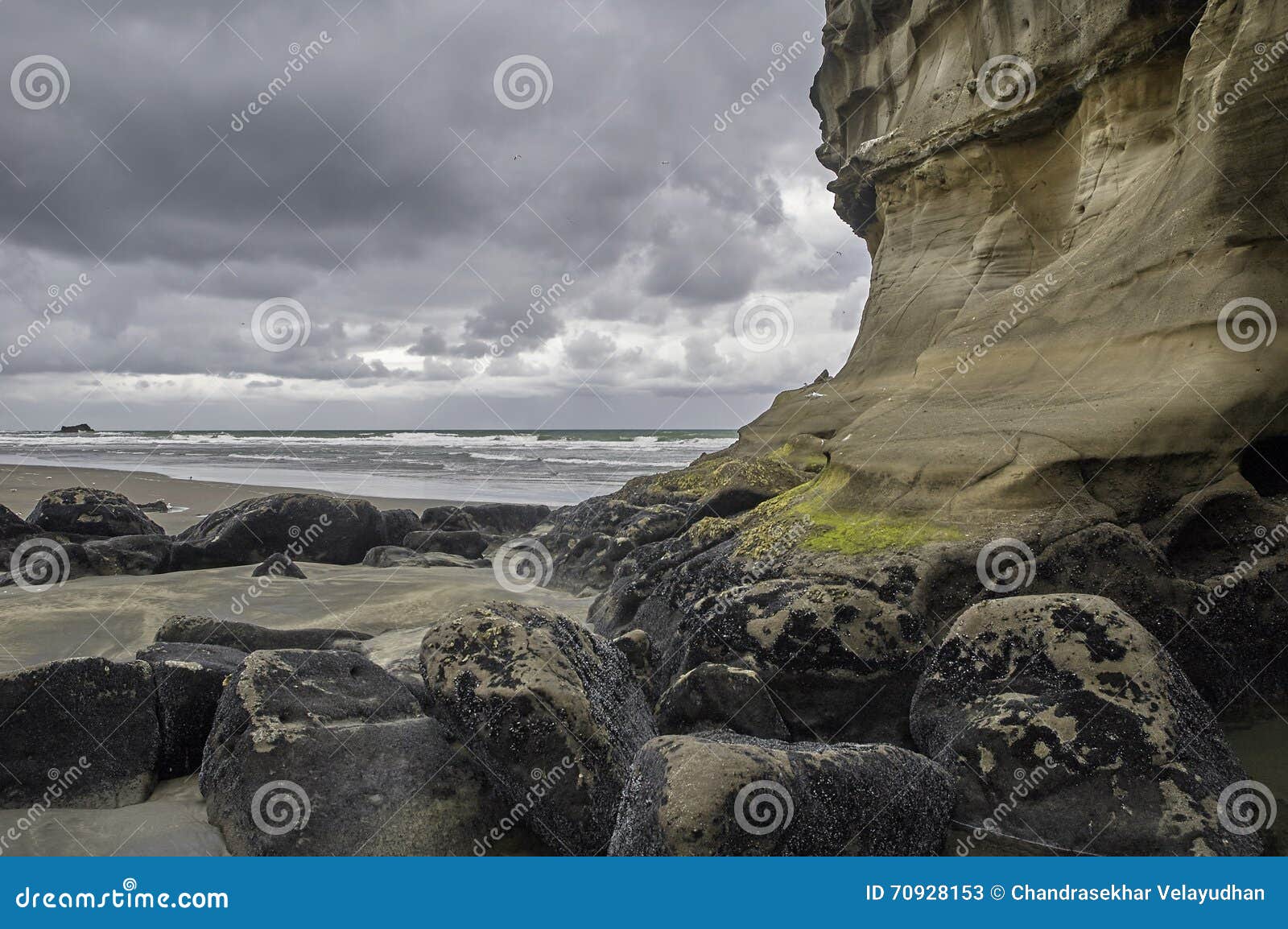 An Imposing Weathered Cliff on a Beach Stock Image - Image of scenic ...