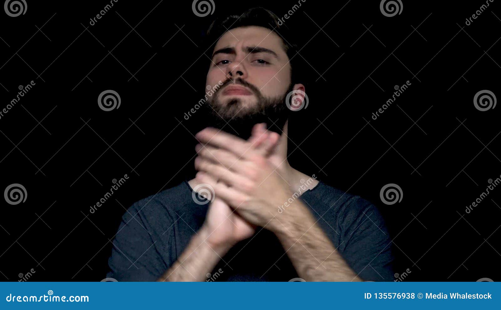 Impressed Young Bearded Man Applauding on Black Background. Young ...
