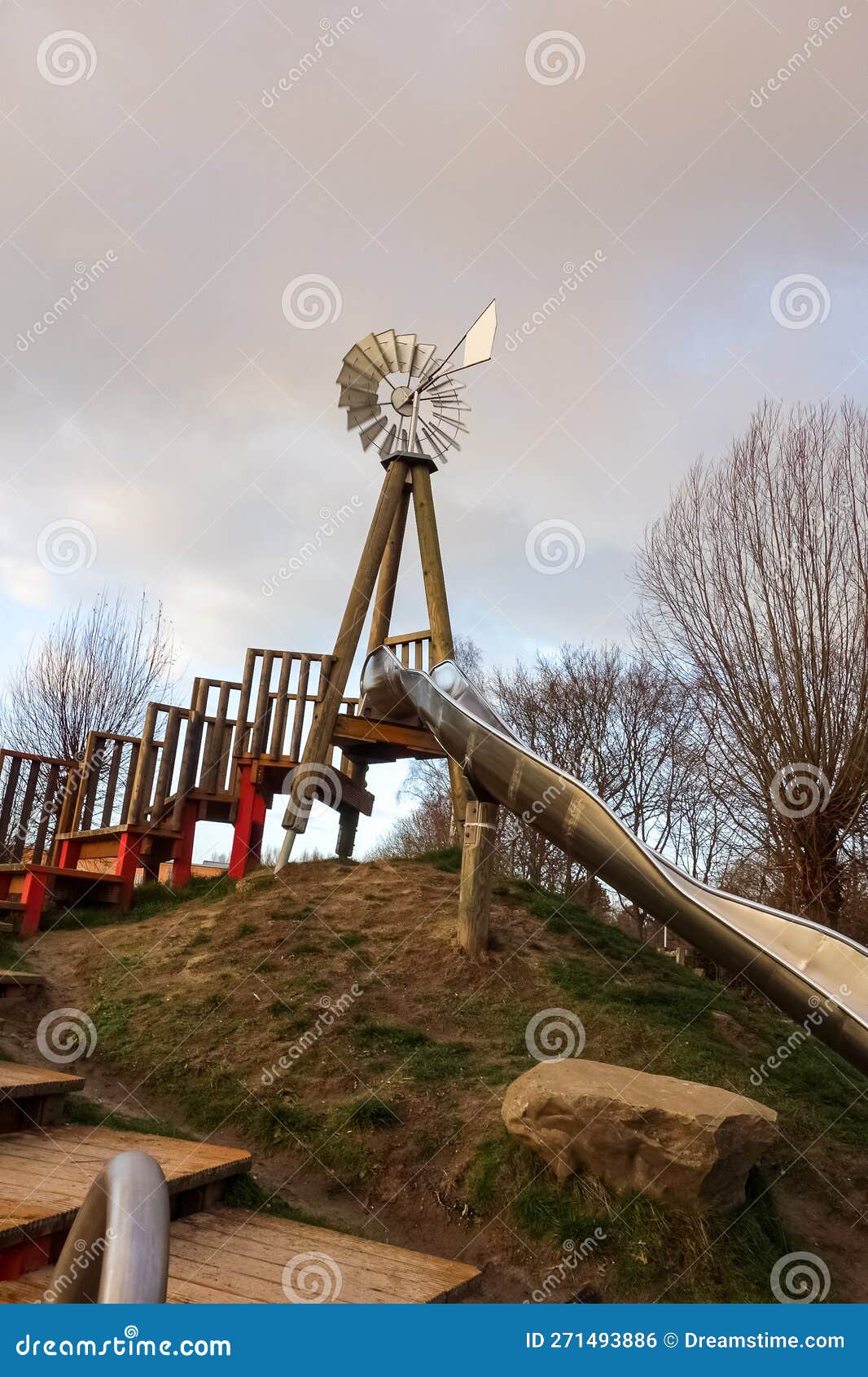 Impressive Playground Slide with a Windmill on Top . Heavy Dark Clouds ...