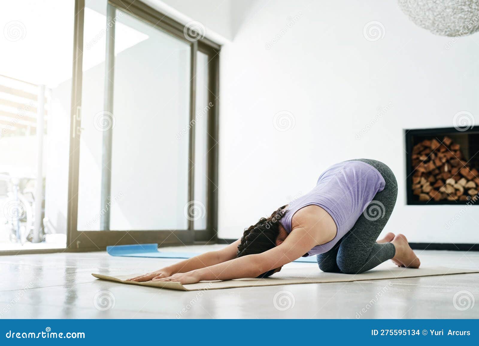 Improving Her Flexibility through Yoga. a Young Woman Practising Yoga ...