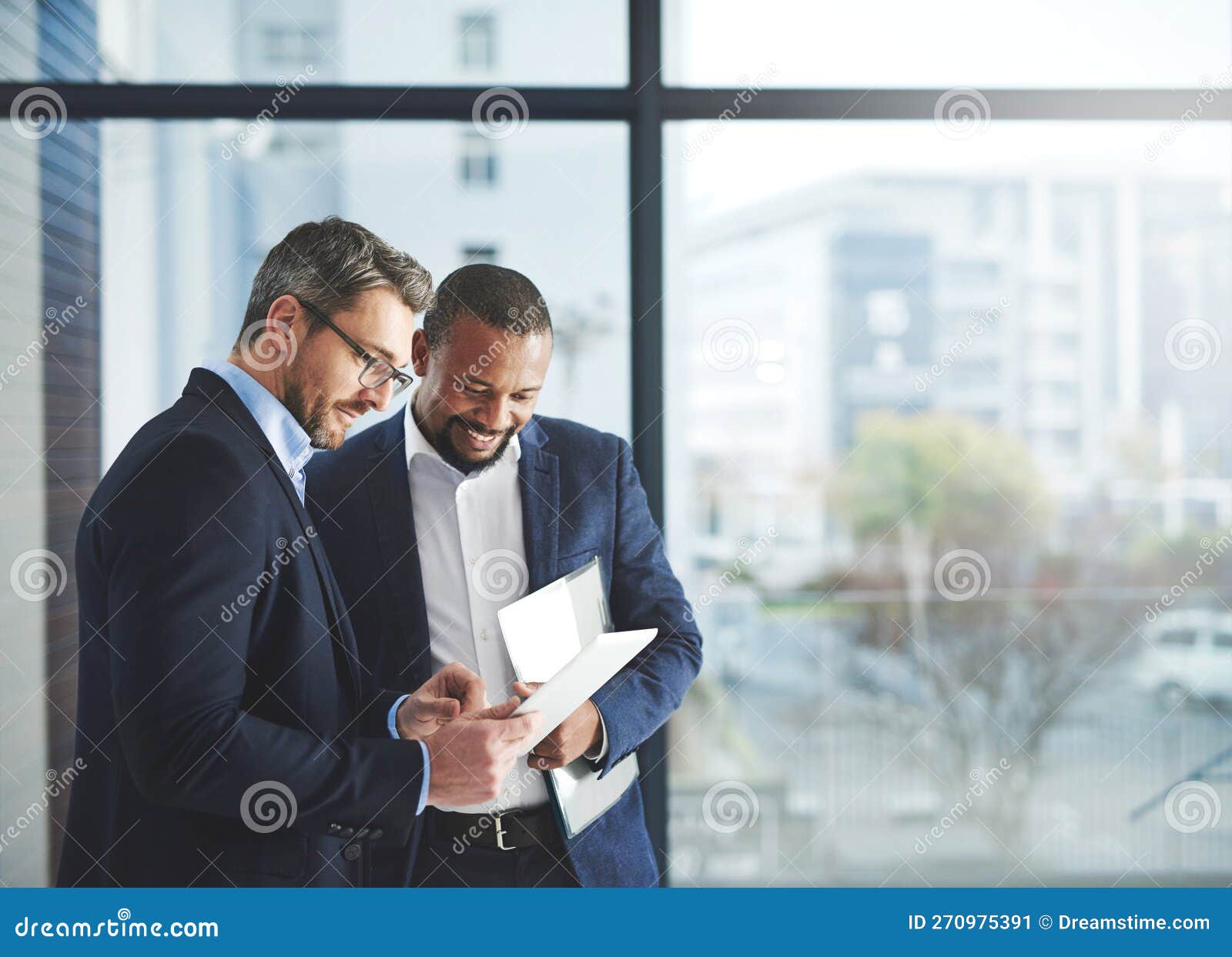 Improving Professional Performance with the Latest Apps. Shot of Two ...