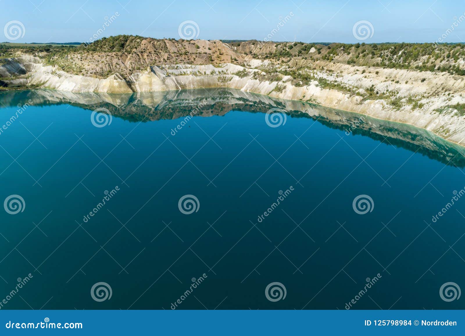 Inactive Gypsum Quarry. in the Quarry is a Lake with Blue Water Stock ...