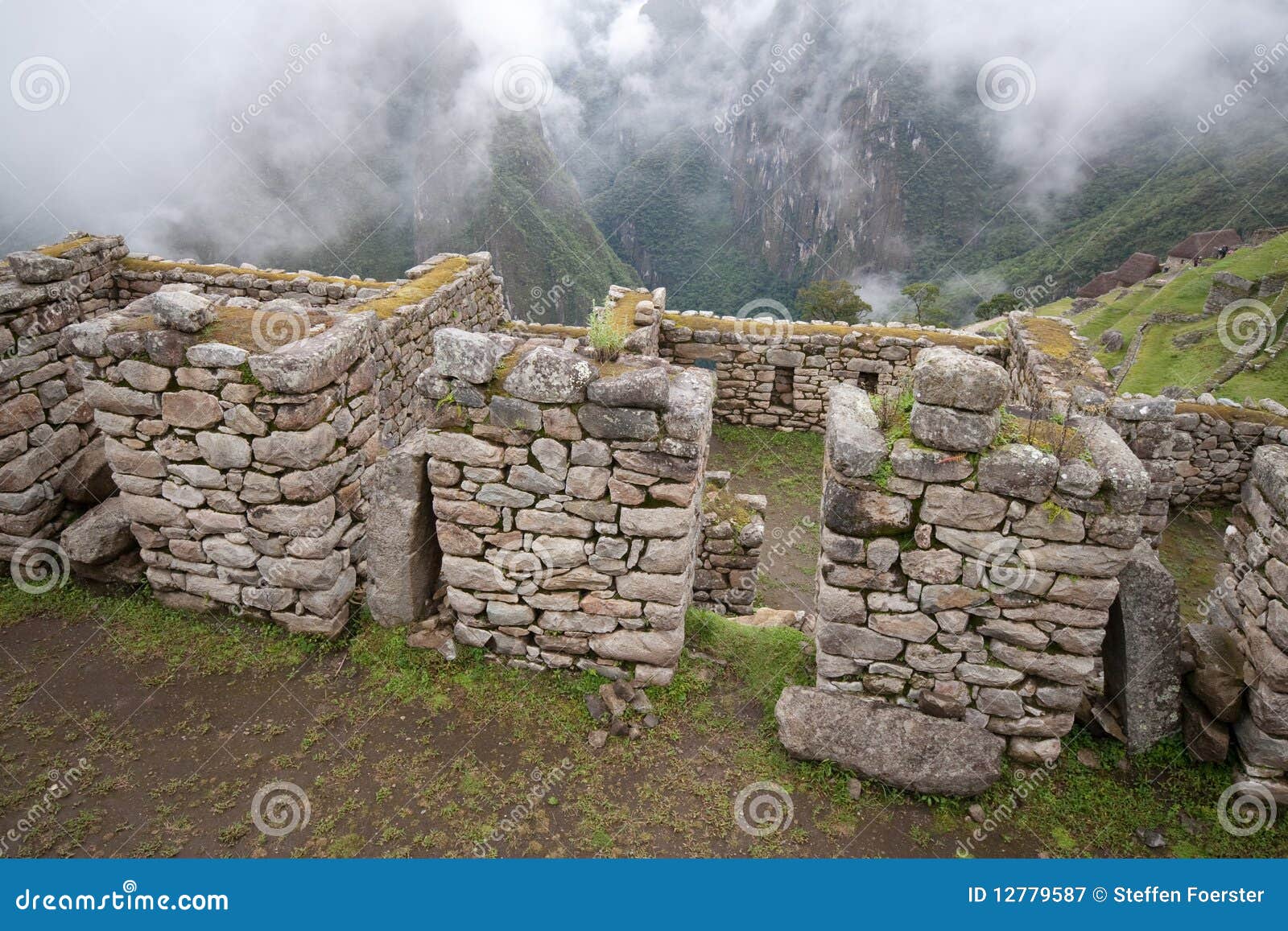 Inca House Seen From Behind Stone Walls At Machu Picchu Historic Site ...
