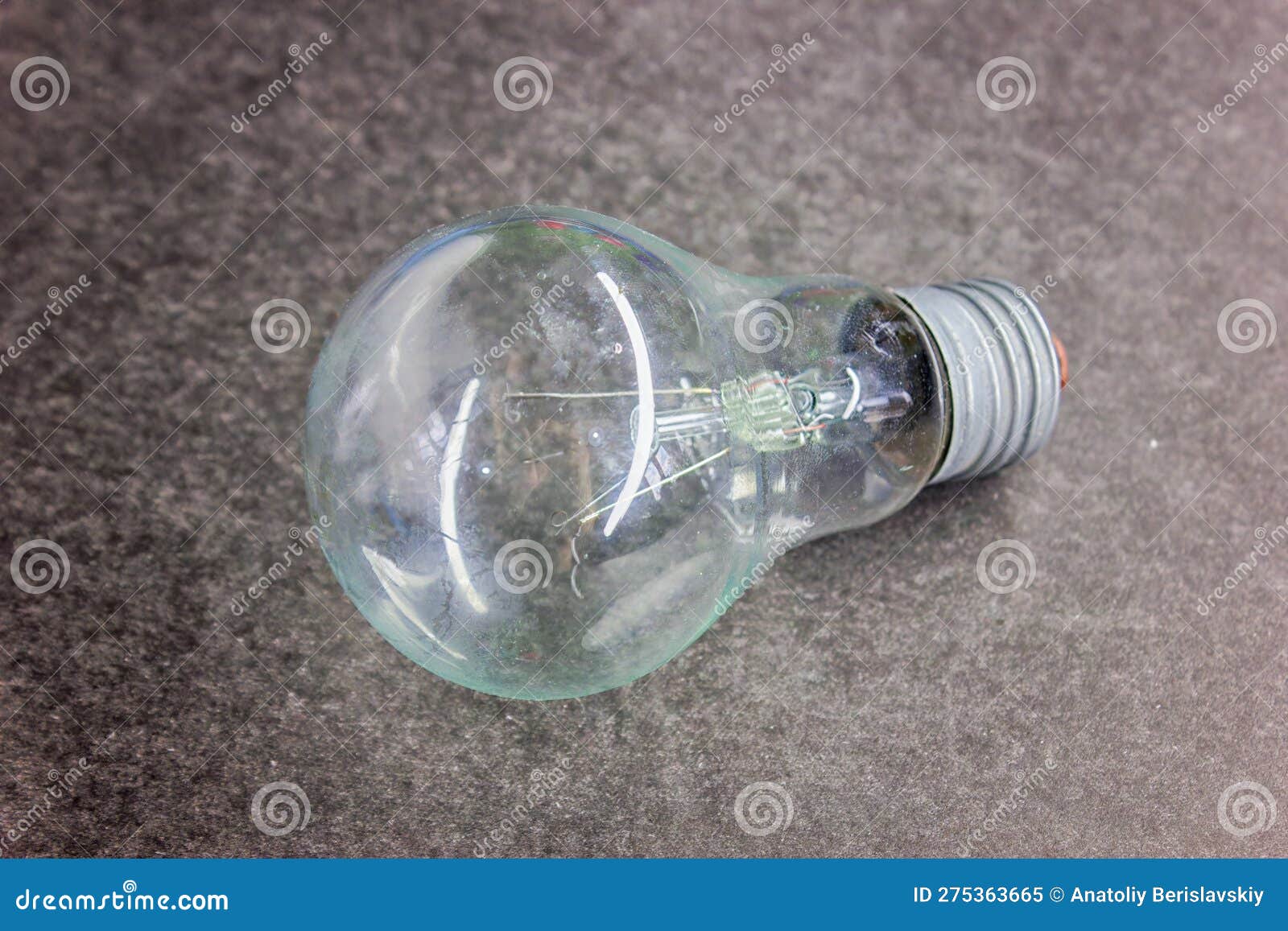 Incandescent Light Bulb on a Dark Gray Background Close-up. Stock Image ...