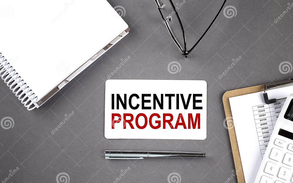 INCENTIVE PROGRAM Text Written on the Card with Notebook and Clipboard ...