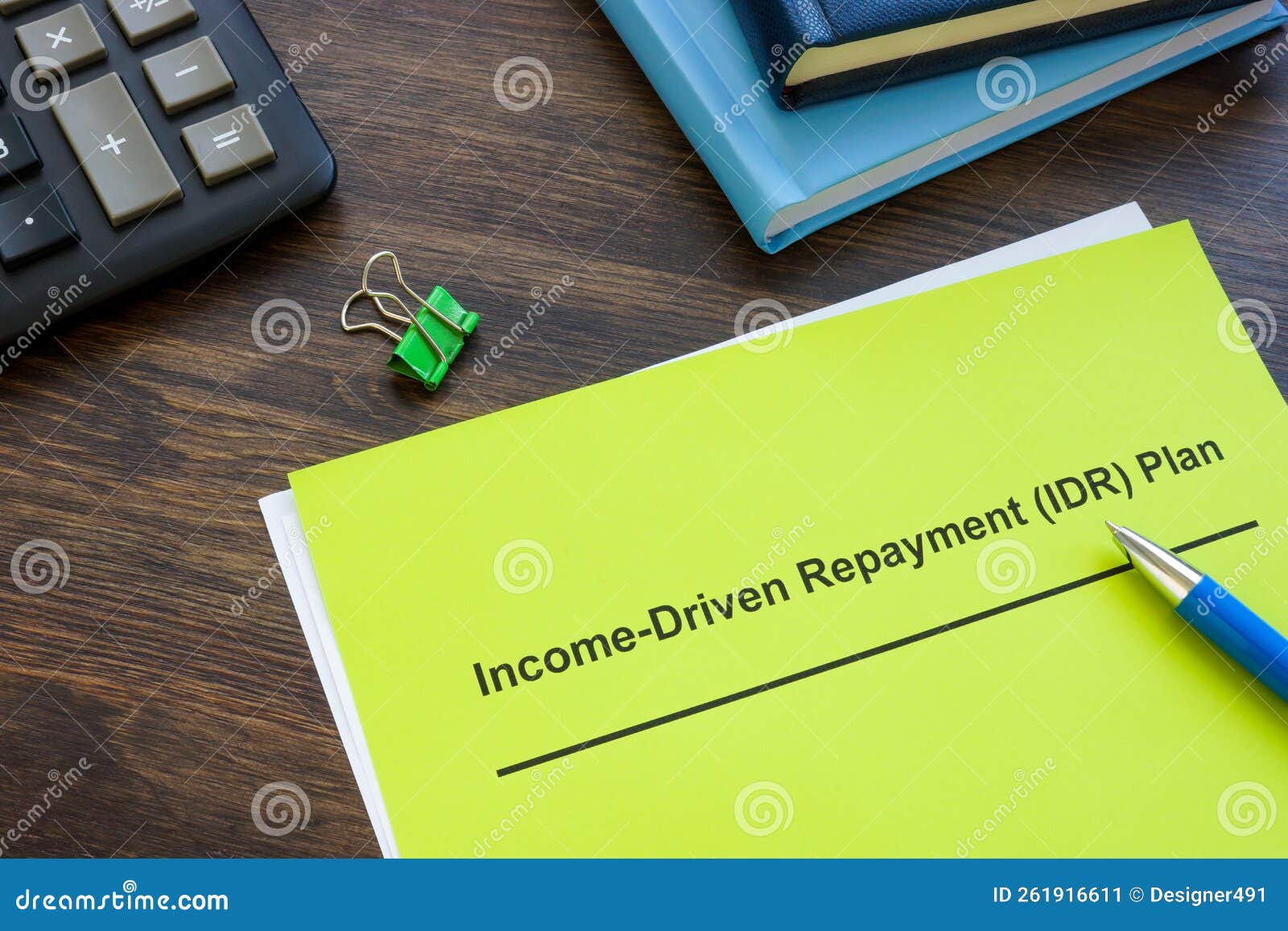 Income Driven Repayment IDR Plan Near Calculator and Notepads. Stock ...