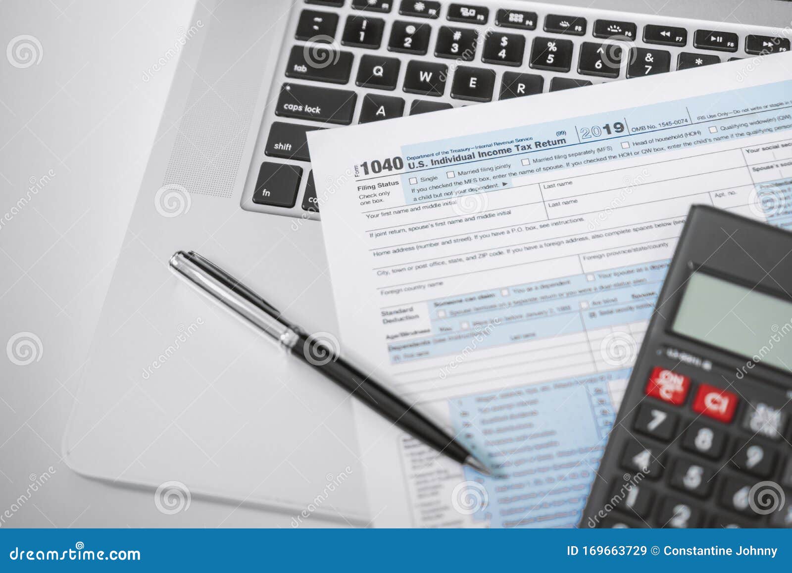 Income Tax Form and Calculator Editorial Stock Image - Image of close ...