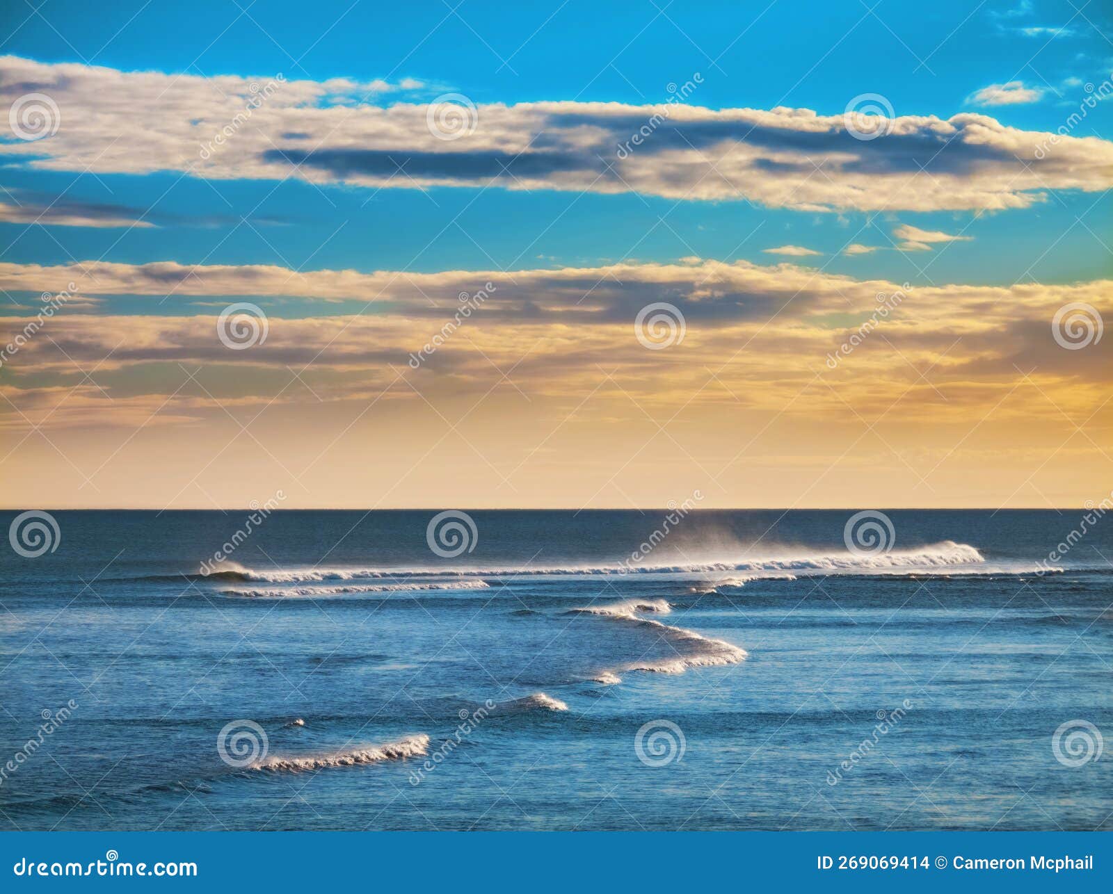 Incoming Surf with Cloudy Sky in Distance Stock Photo - Image of ...