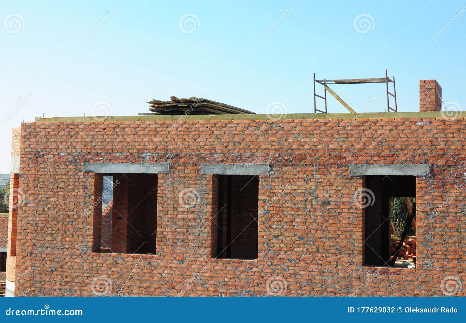 Incomplete Brick House Building With Scaffoldings On The Stage Of ...