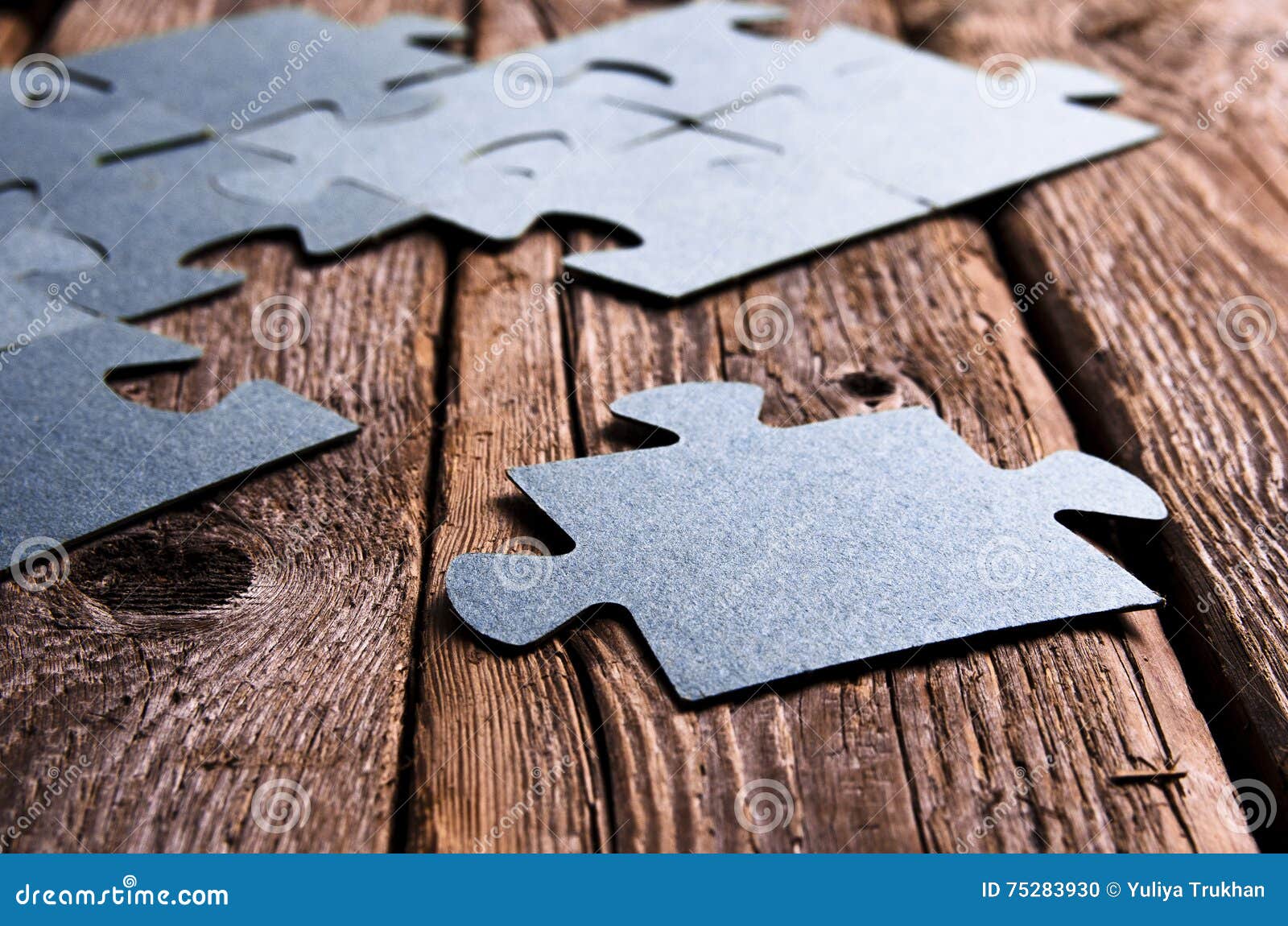 Incomplete Puzzles Lying on Wooden Rustic Boards. Stock Photo - Image ...