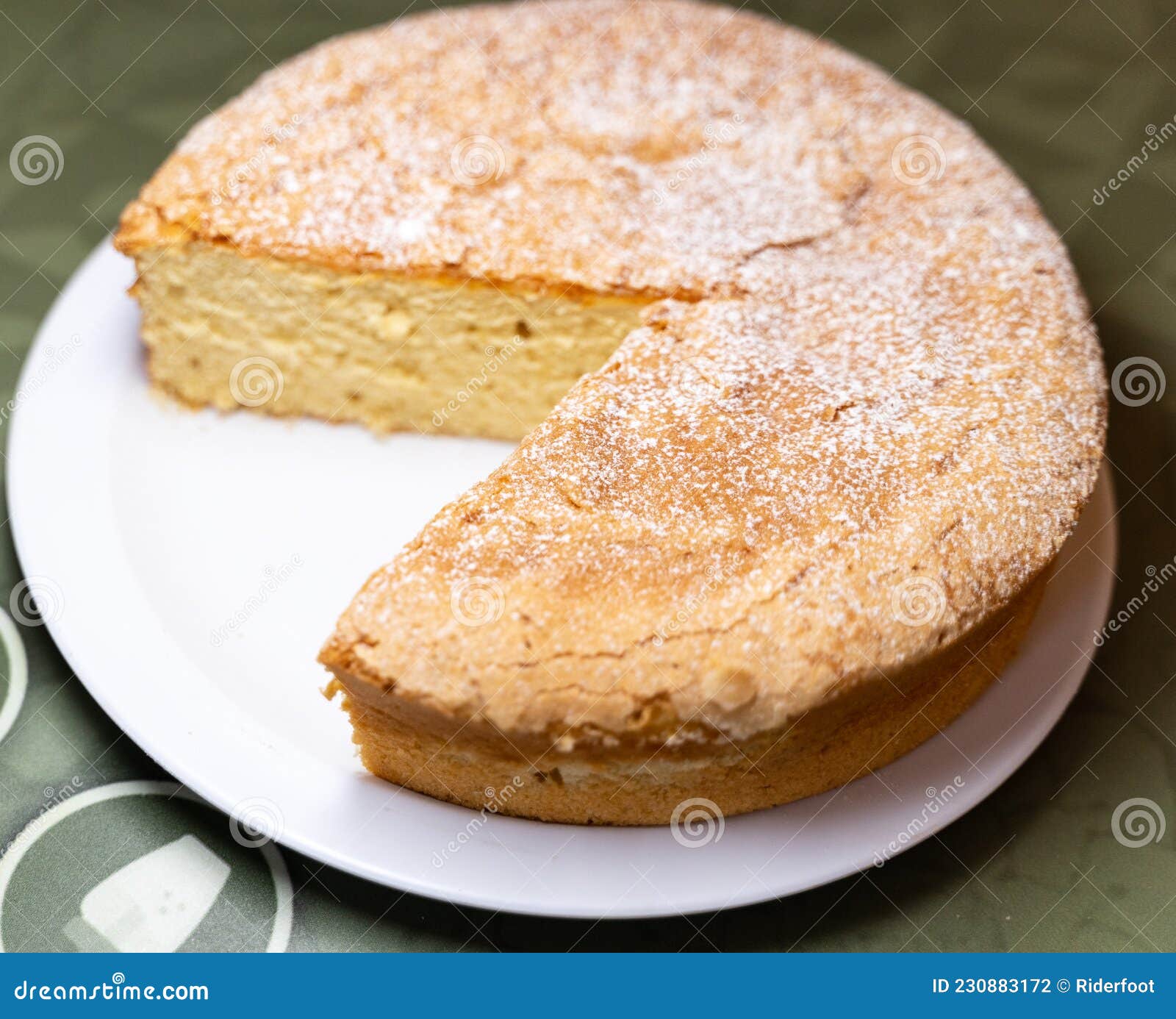 Incomplete Santiago Cake with One Slice Missing on a White Plate Stock ...