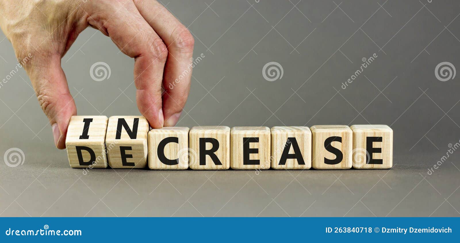 Increase or Decrease Symbol. Concept Words Increase and Decrease on Wooden Cubes. Businessman ...