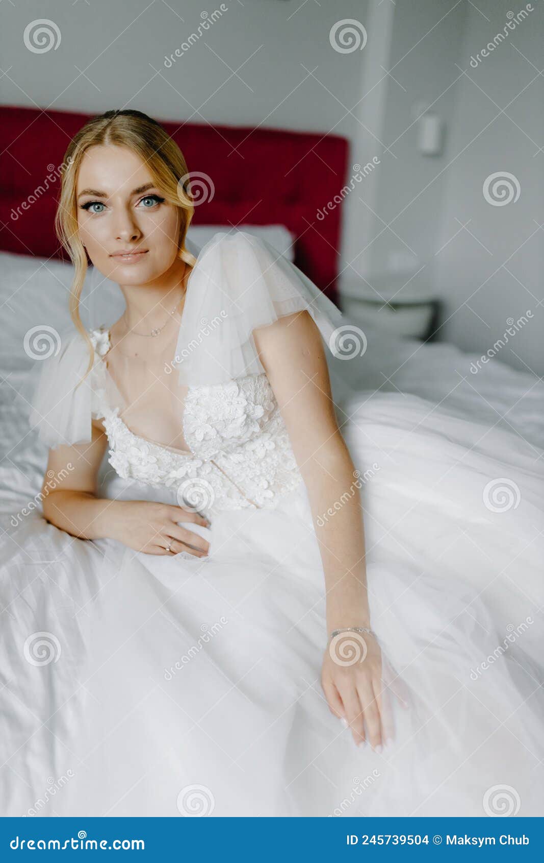 Incredibly Beautiful Bride Lying on the Bed and Looking at the Camera ...
