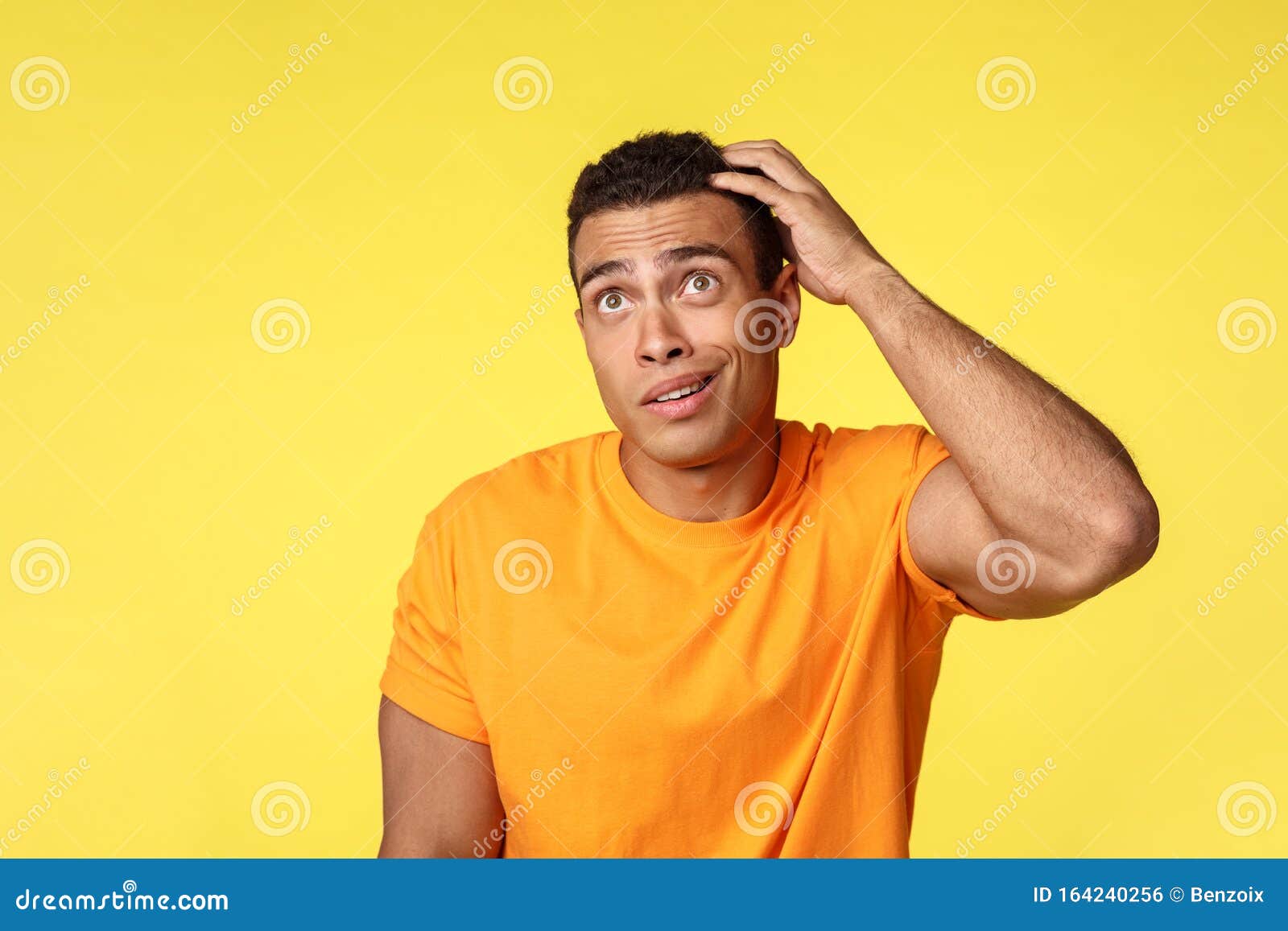 Indecisive Pensive Handsome Silly Guy In T Shirt Scratch Head And Look