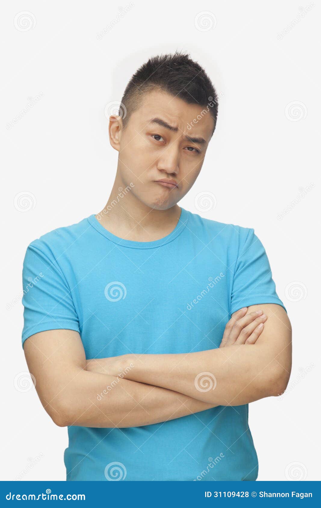 Indecisive Young Man with Arms Crossed, Studio Shot Stock Photo - Image ...