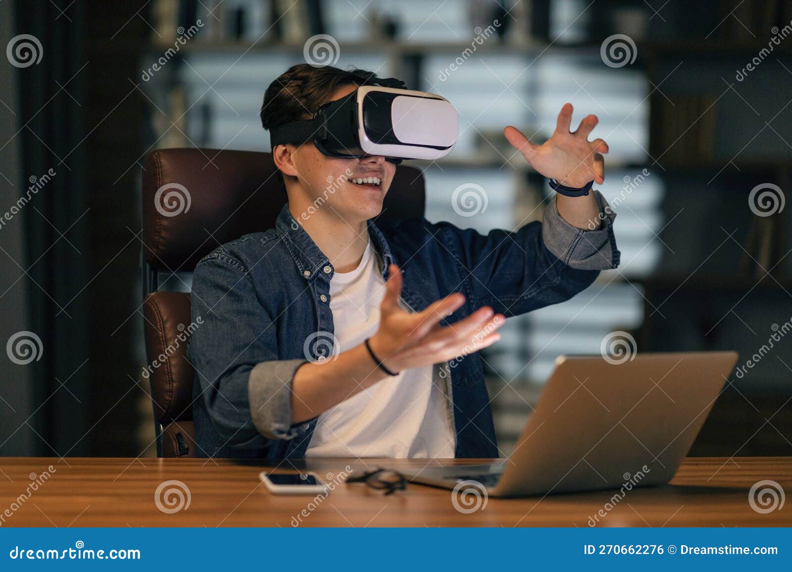 Independent Contractor Using Laptop and Wireless VR Headset at ...