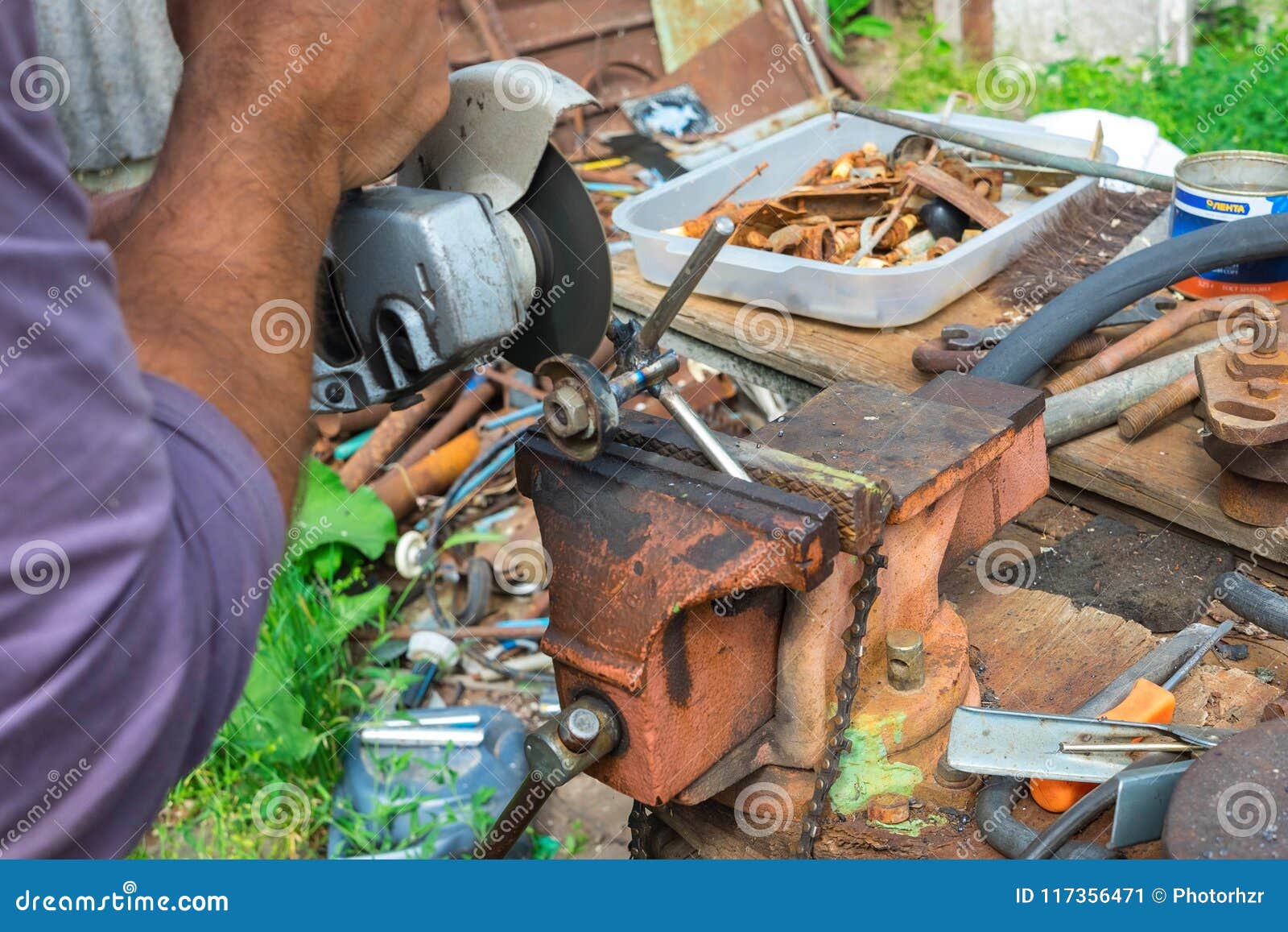 Independent Tool Making Using A Vise And Angle Grinder, Hands Of A ...