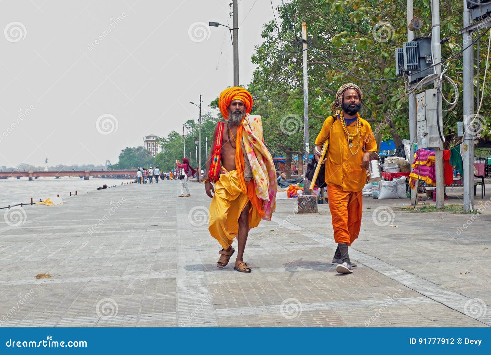 INDIA, HARIDWAR - APRIL 24, 2017: Two Sadhus Walking Along the R ...