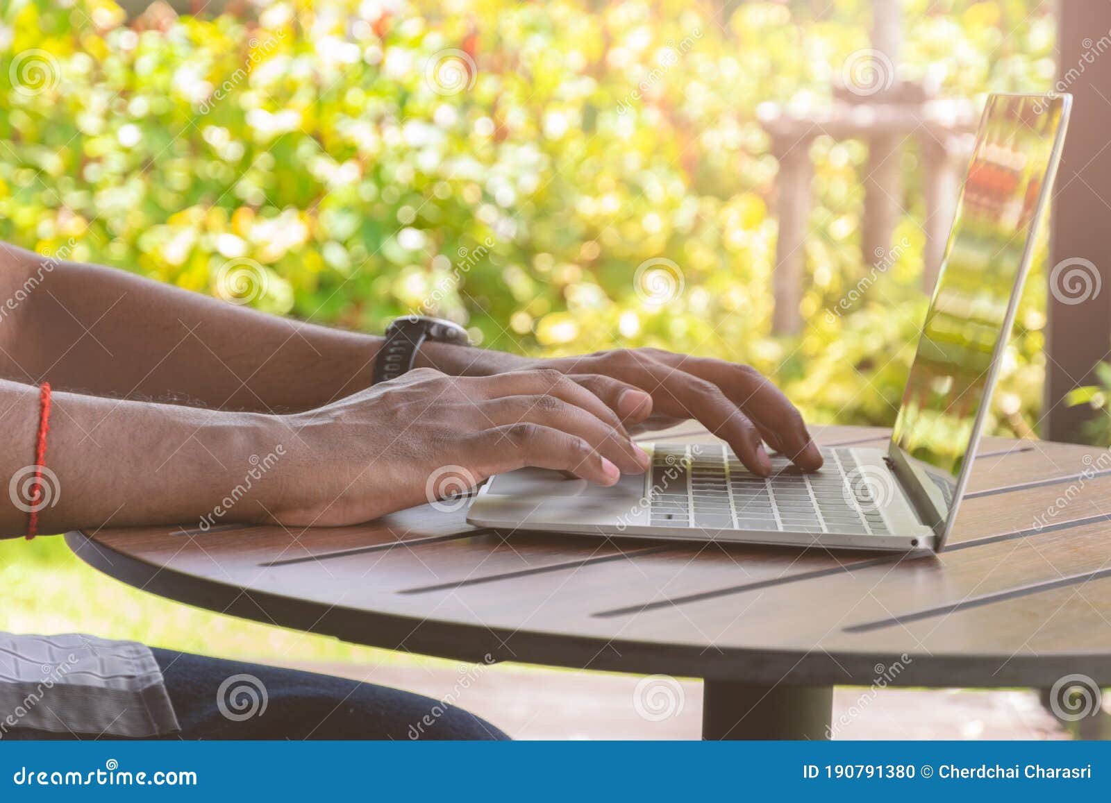 India or Malaysia, Working or Typing on Laptop Computer at Cafe Shop ...