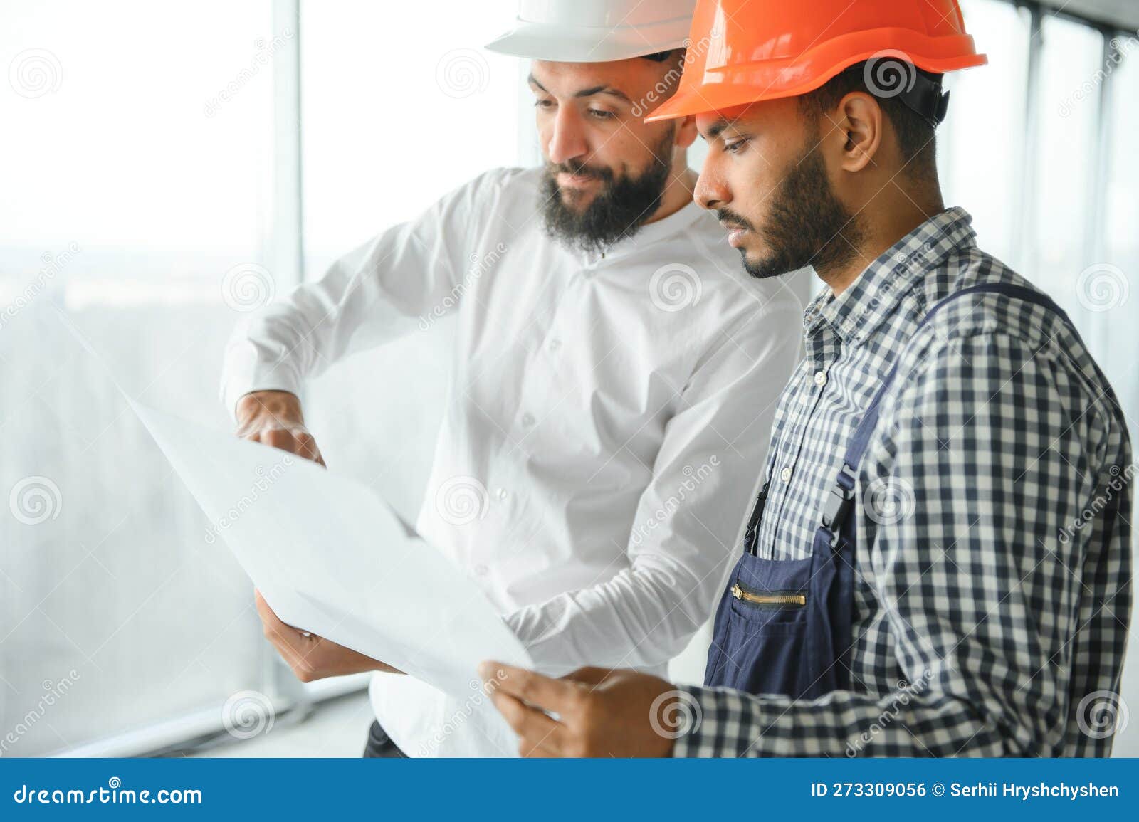 Indian and Arabian Engineers. Contractor and Architect Talking about ...