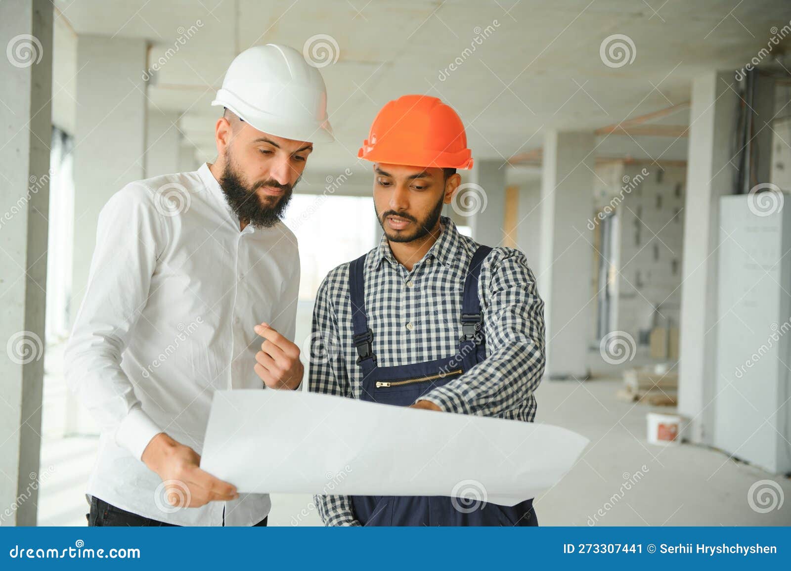 Indian and Arabian Engineers. Contractor and Architect Talking about ...