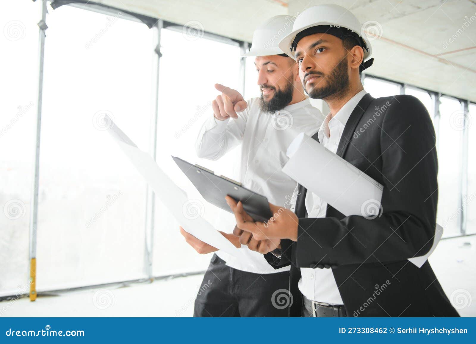 Indian and Arabian Engineers. Contractor and Architect Talking about ...