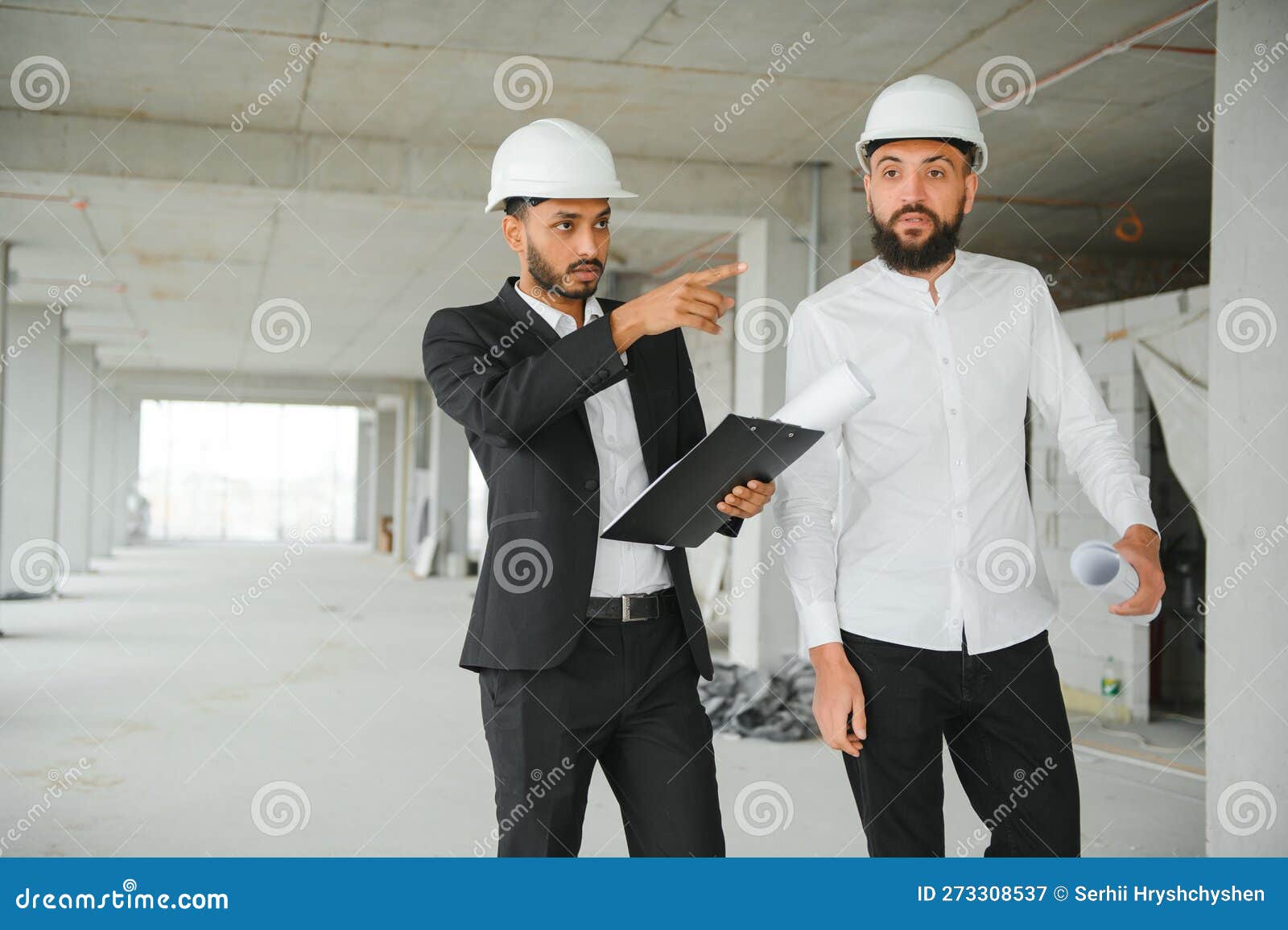 Indian and Arabian Engineers. Contractor and Architect Talking about ...
