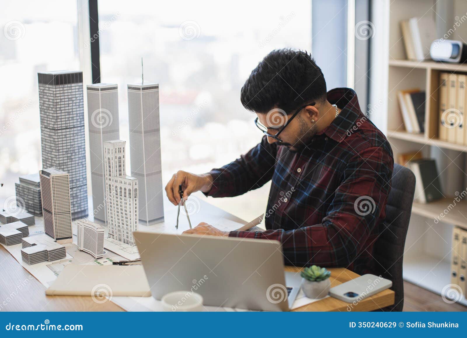 Indian Architect Measuring City Model in Modern Office Setting Stock ...