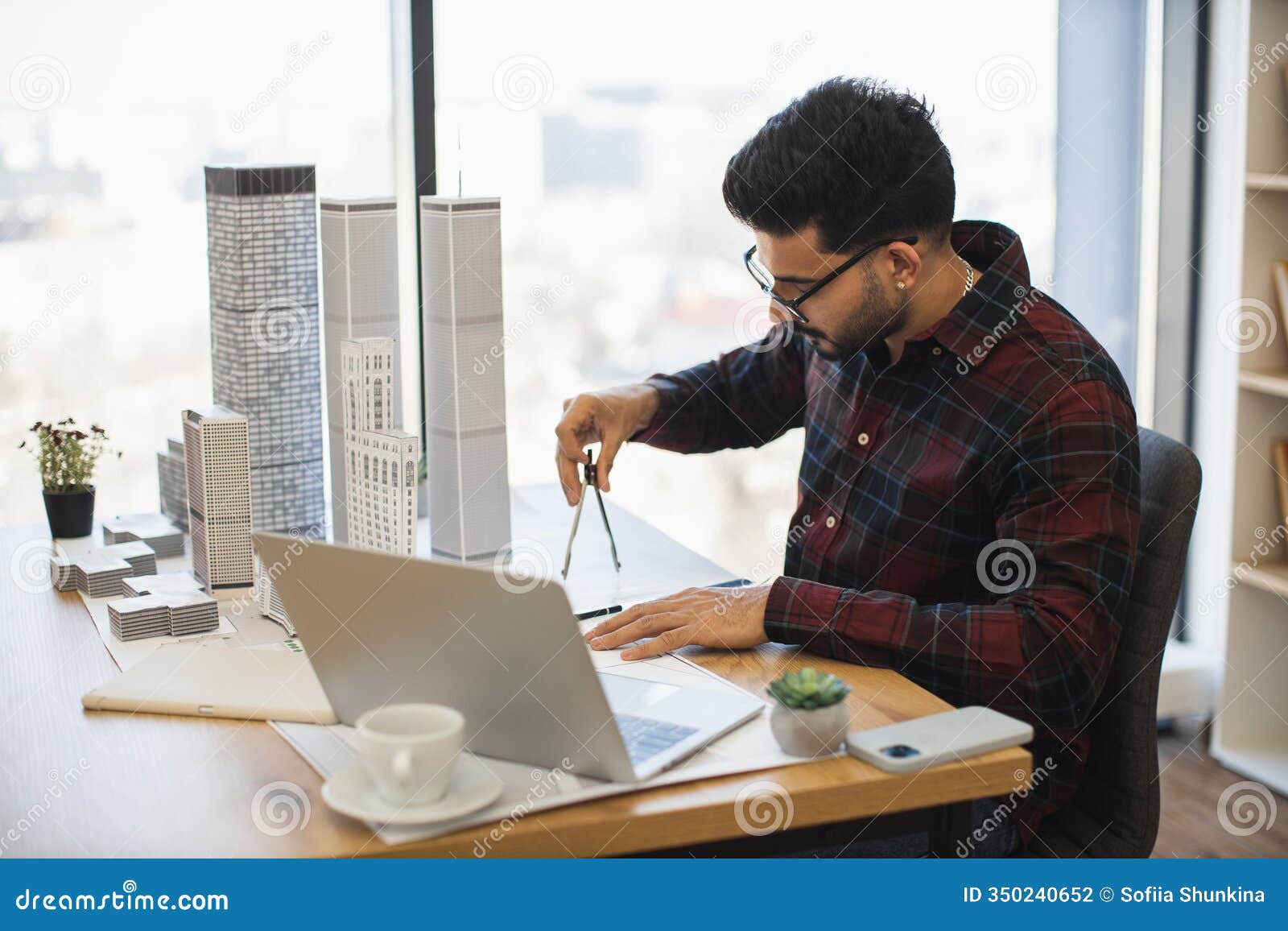 Indian Architect Measuring City Model in Modern Office Setting Stock ...