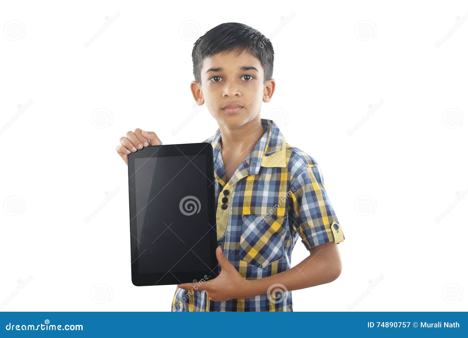 Indian boy holding tablet stock image. Image of looking - 74890757