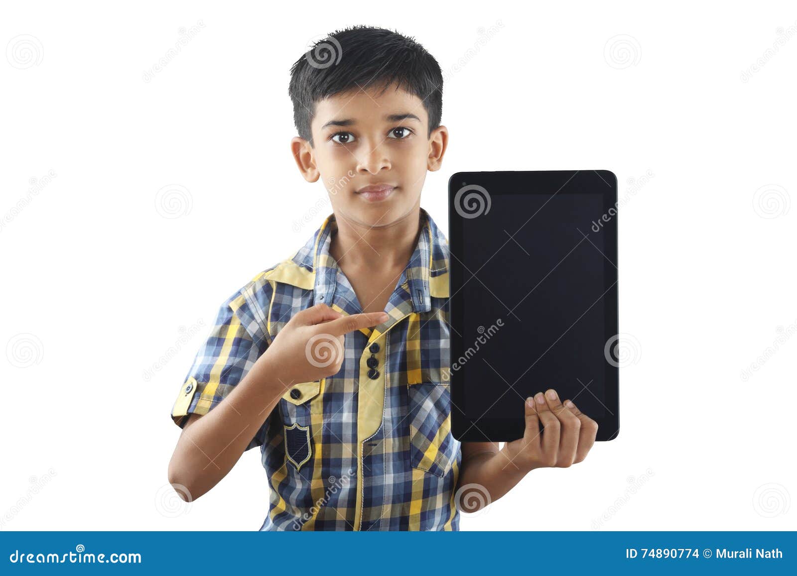 Indian boy holding tablet stock photo. Image of fingers - 74890774