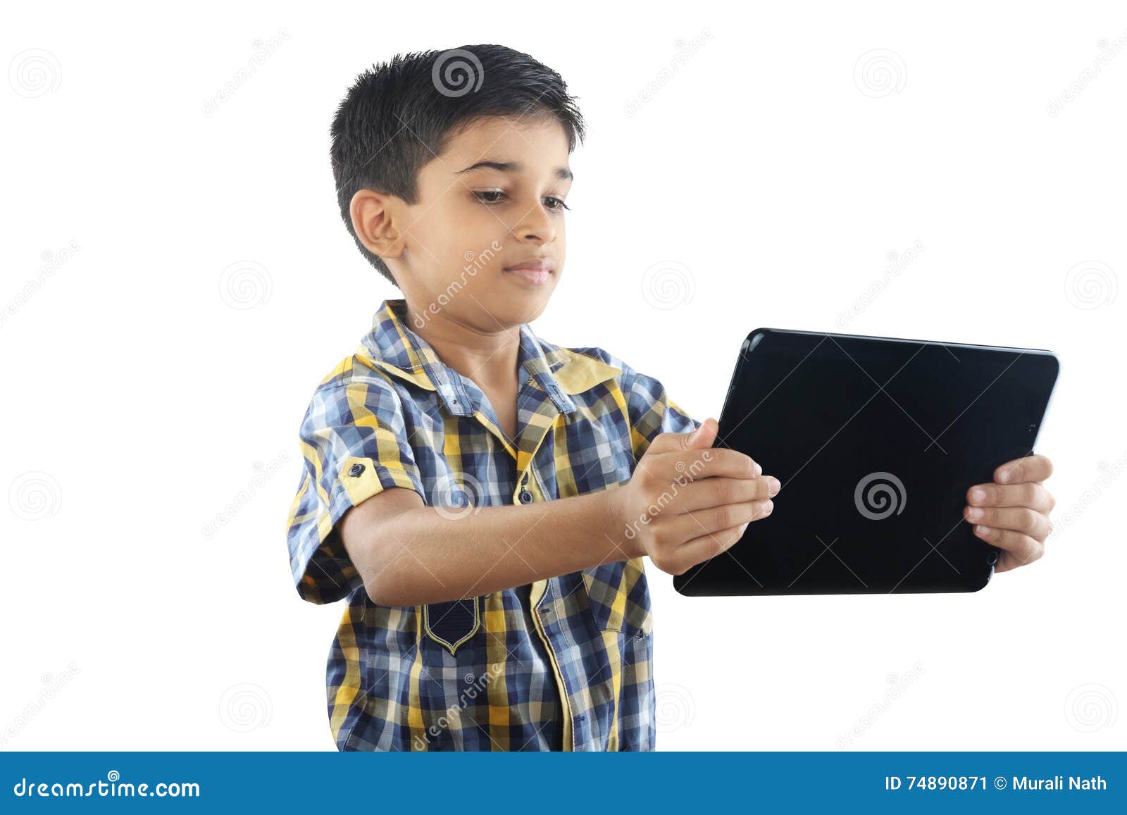 Indian boy holding tablet stock image. Image of posing - 74890871