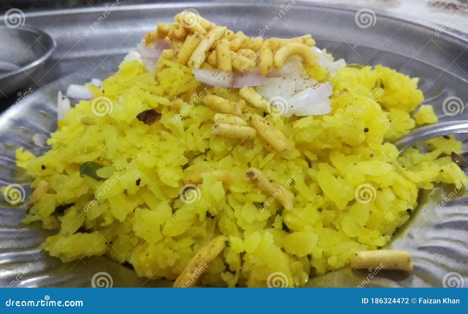 Indian Breakfast Poha Garnished with Sev and Onions Stock Photo - Image ...