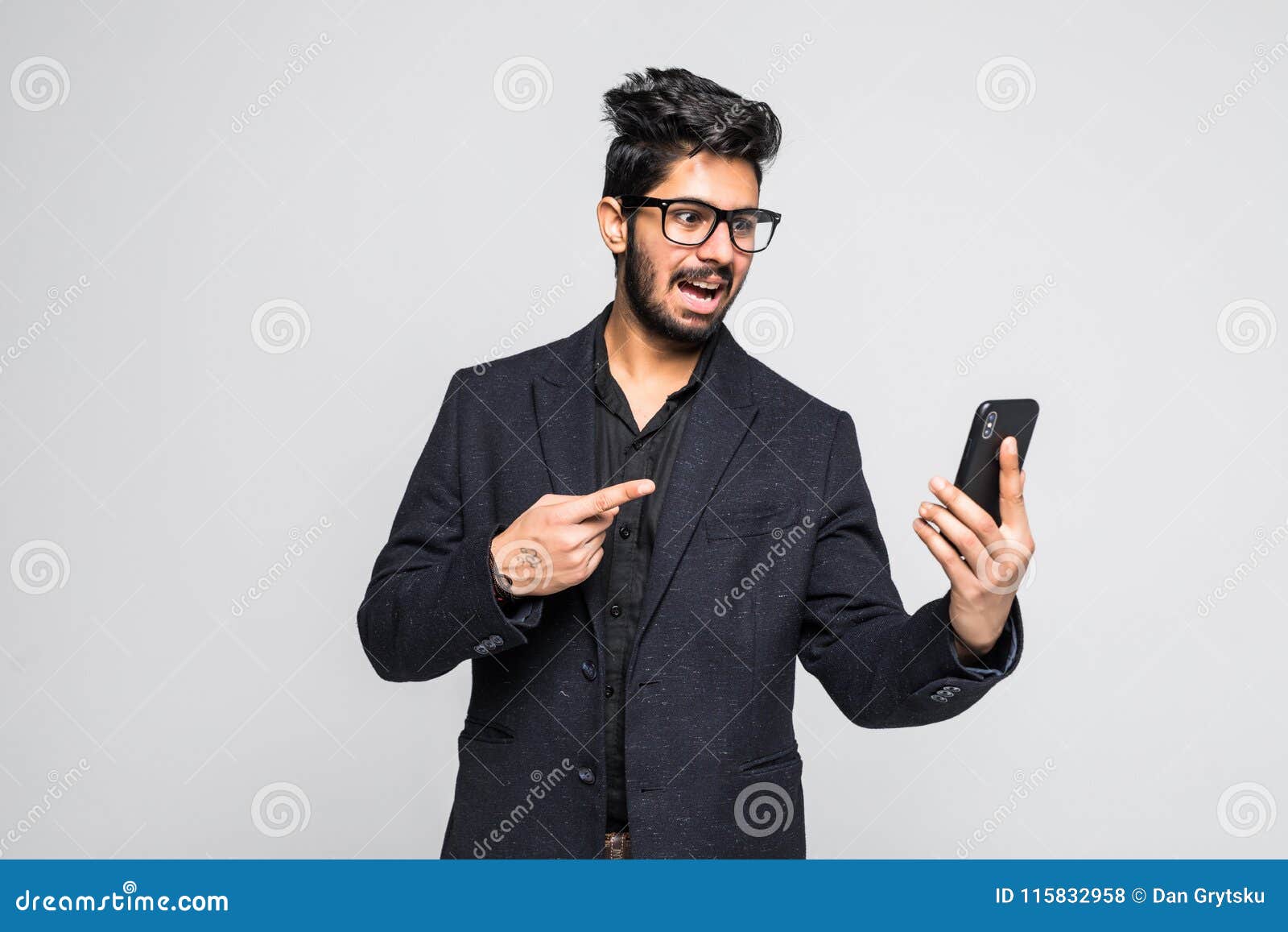 An Indian Business Man Points His Finger on Mobile Phone. Stock Photo ...
