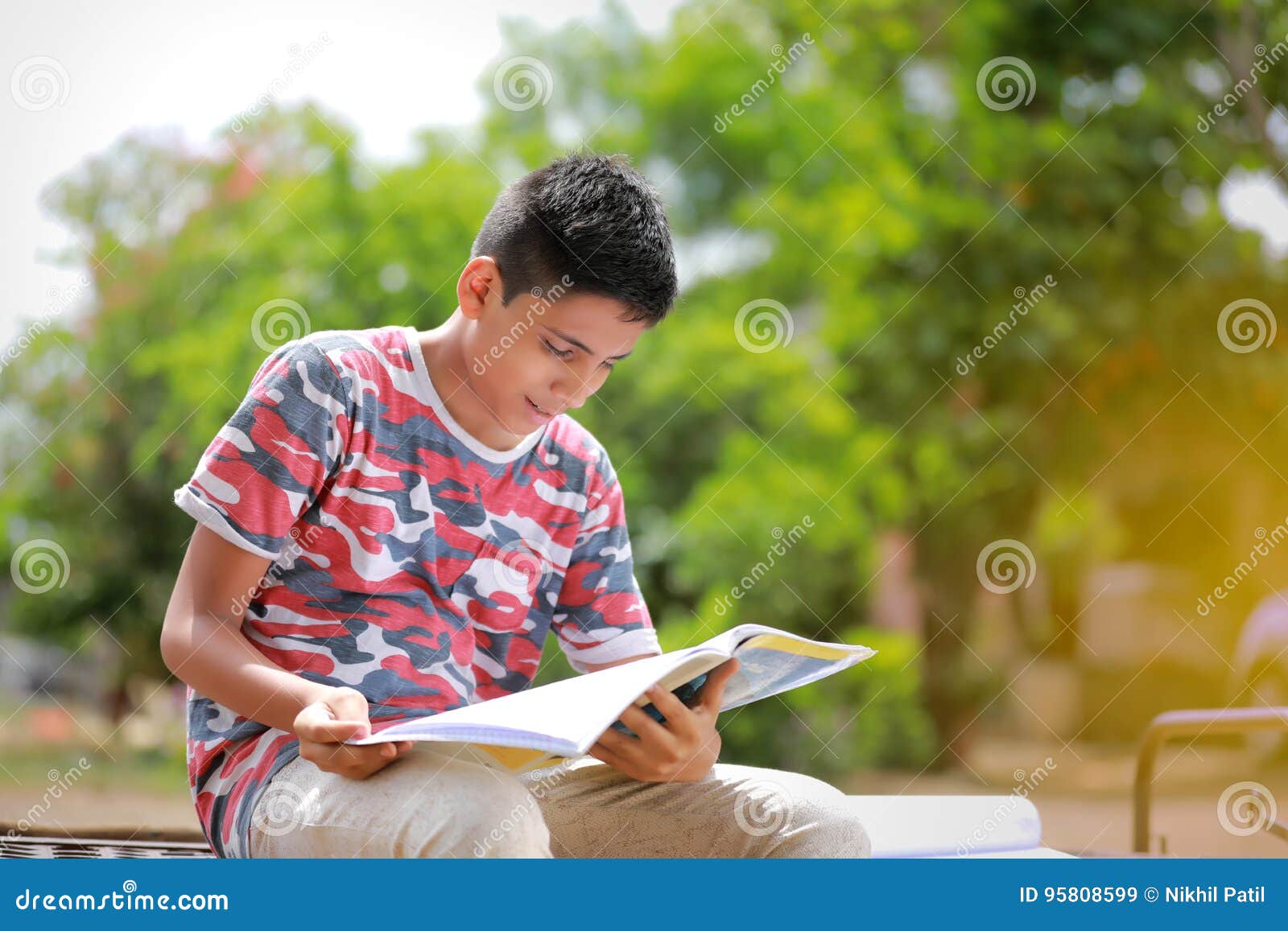Indian Child Reading a Book Stock Image - Image of child, looking: 95808599
